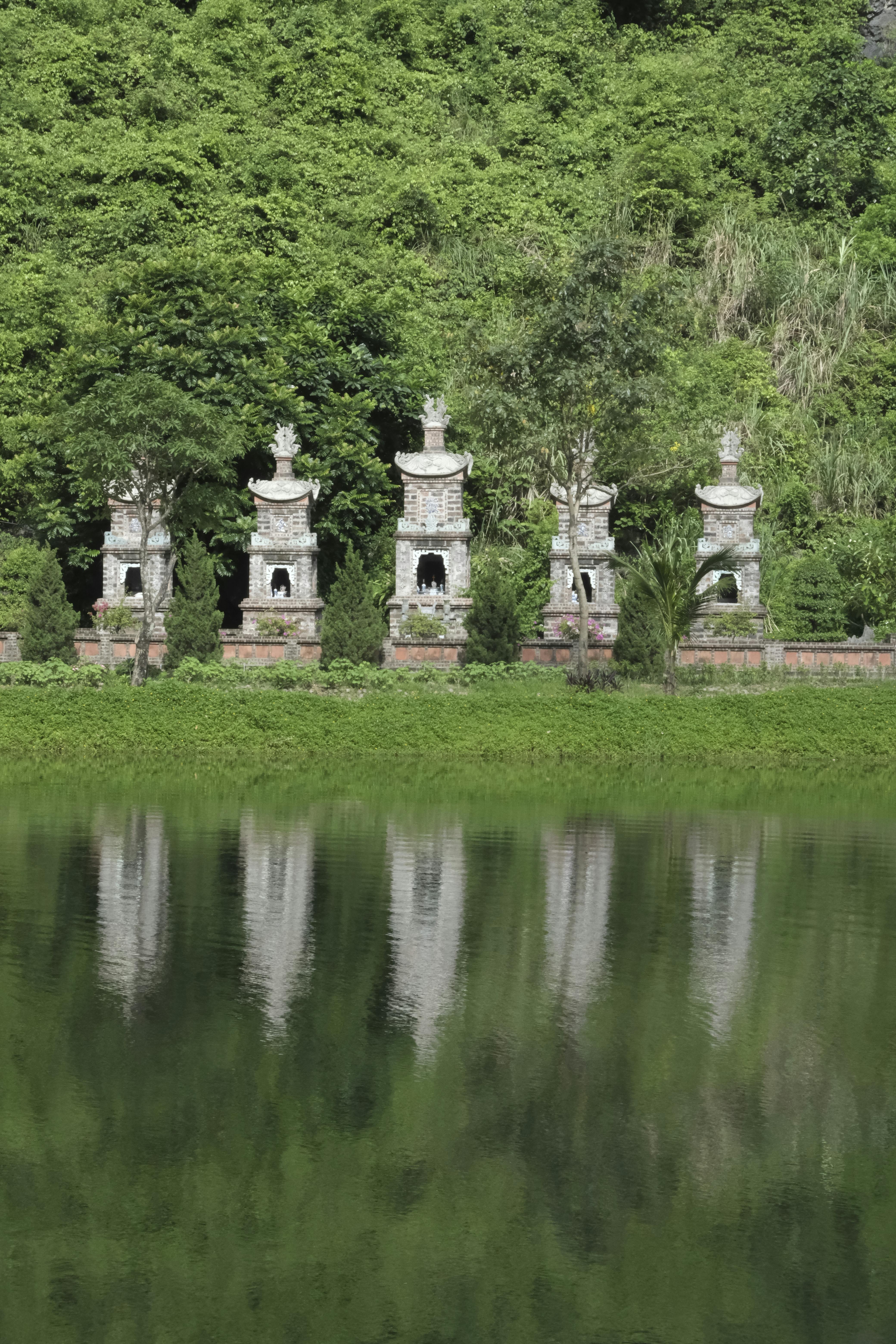 Stone Shrines over Lake in Summer · Free Stock Photo