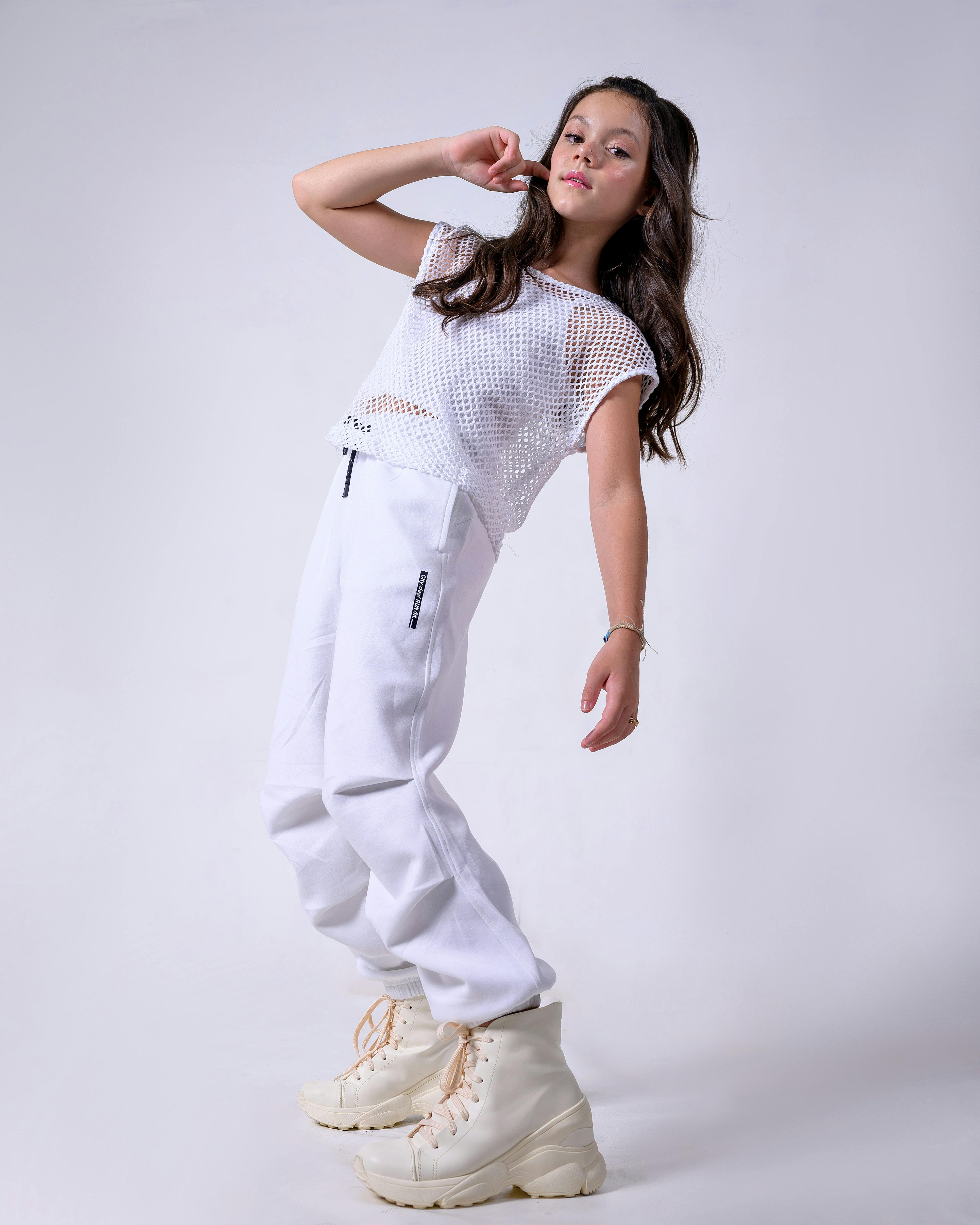 A Stylish Young Girl Posing in Studio · Free Stock Photo