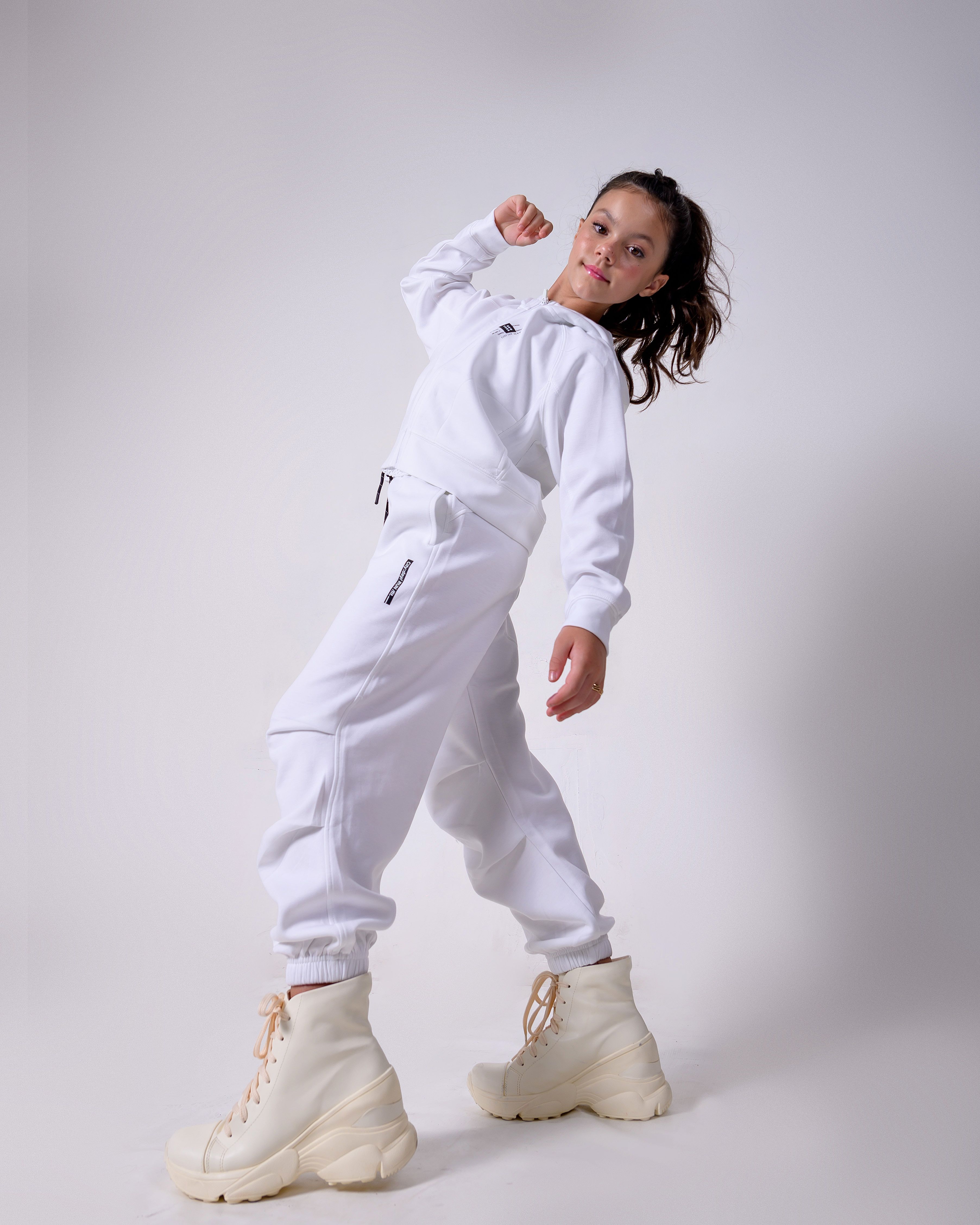 Girl posing in Tracksuit and White Boots · Free Stock Photo