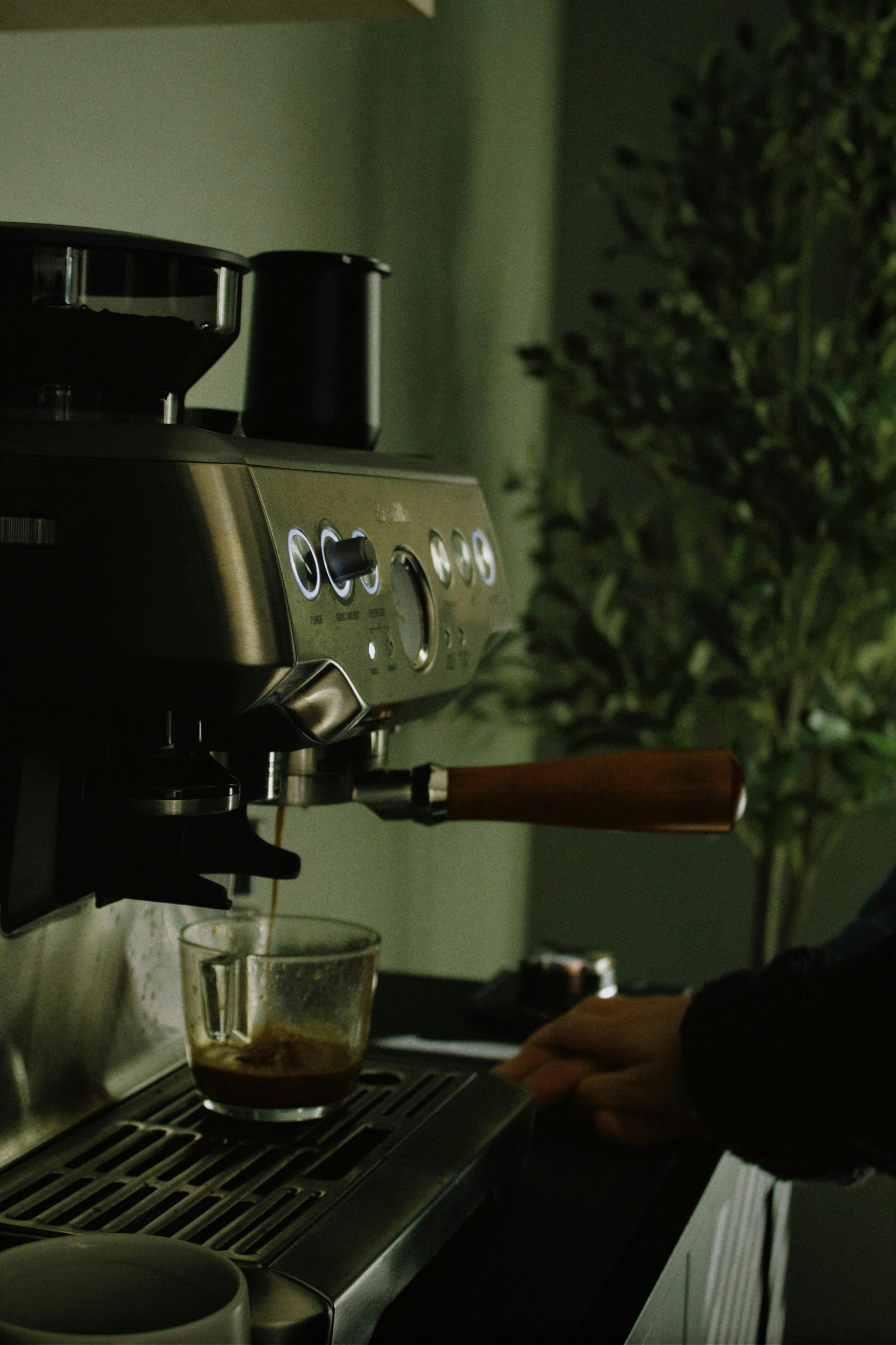 Person Using Espresso Machine · Free Stock Photo