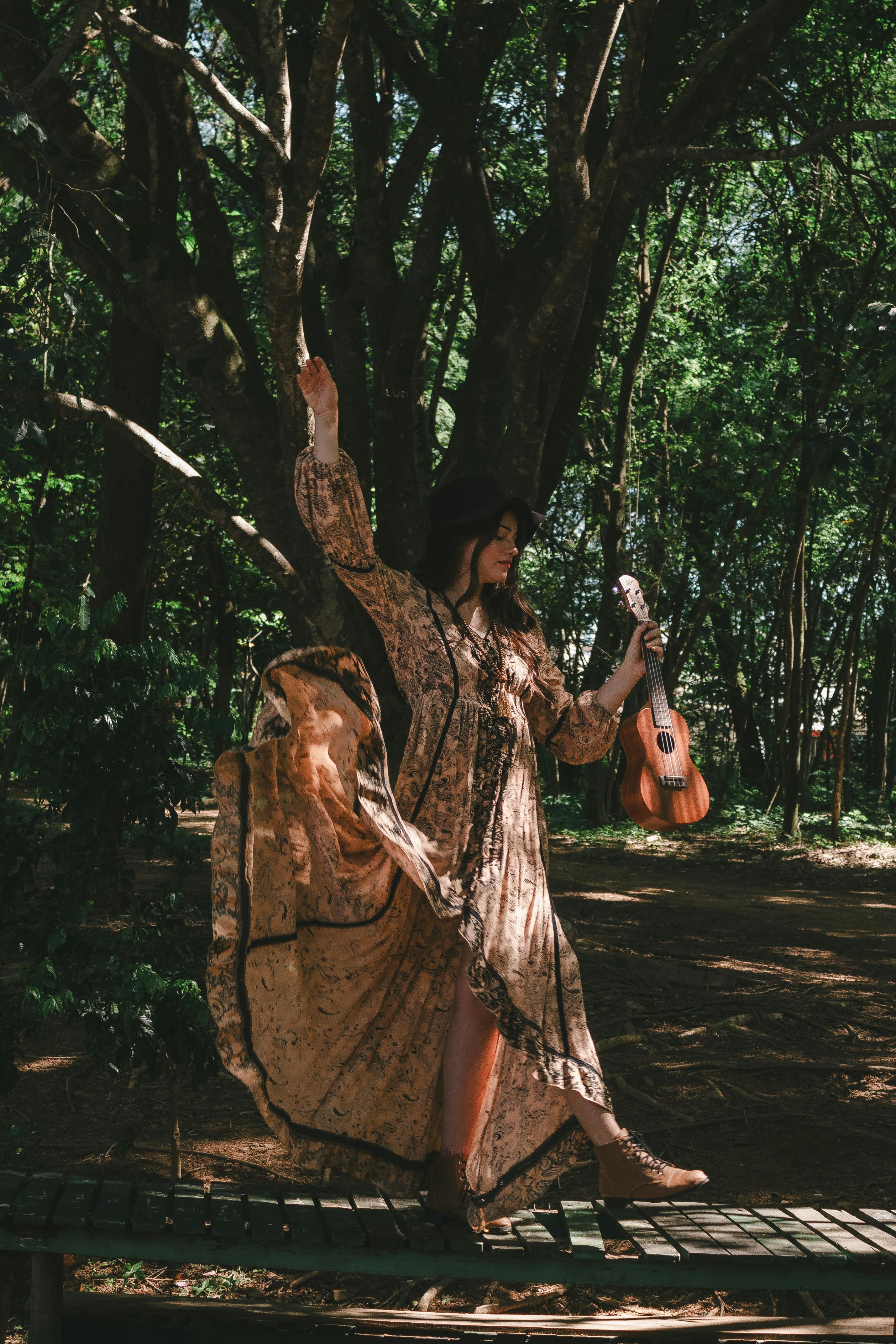 A Dancing Woman with Ukulele · Free Stock Photo