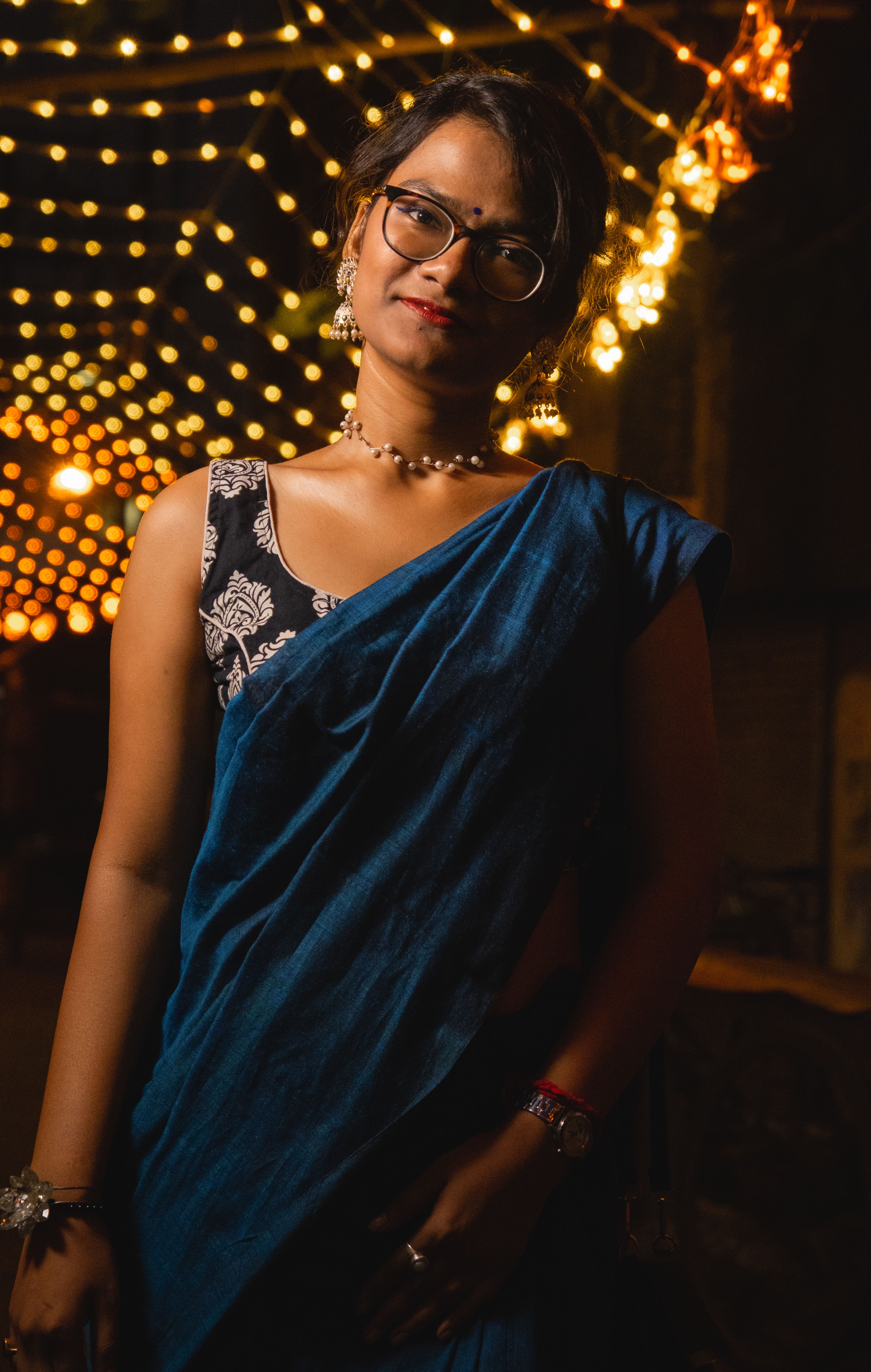 Woman in Blue Sari Dress on Walkway Under String Lights Decoration ...