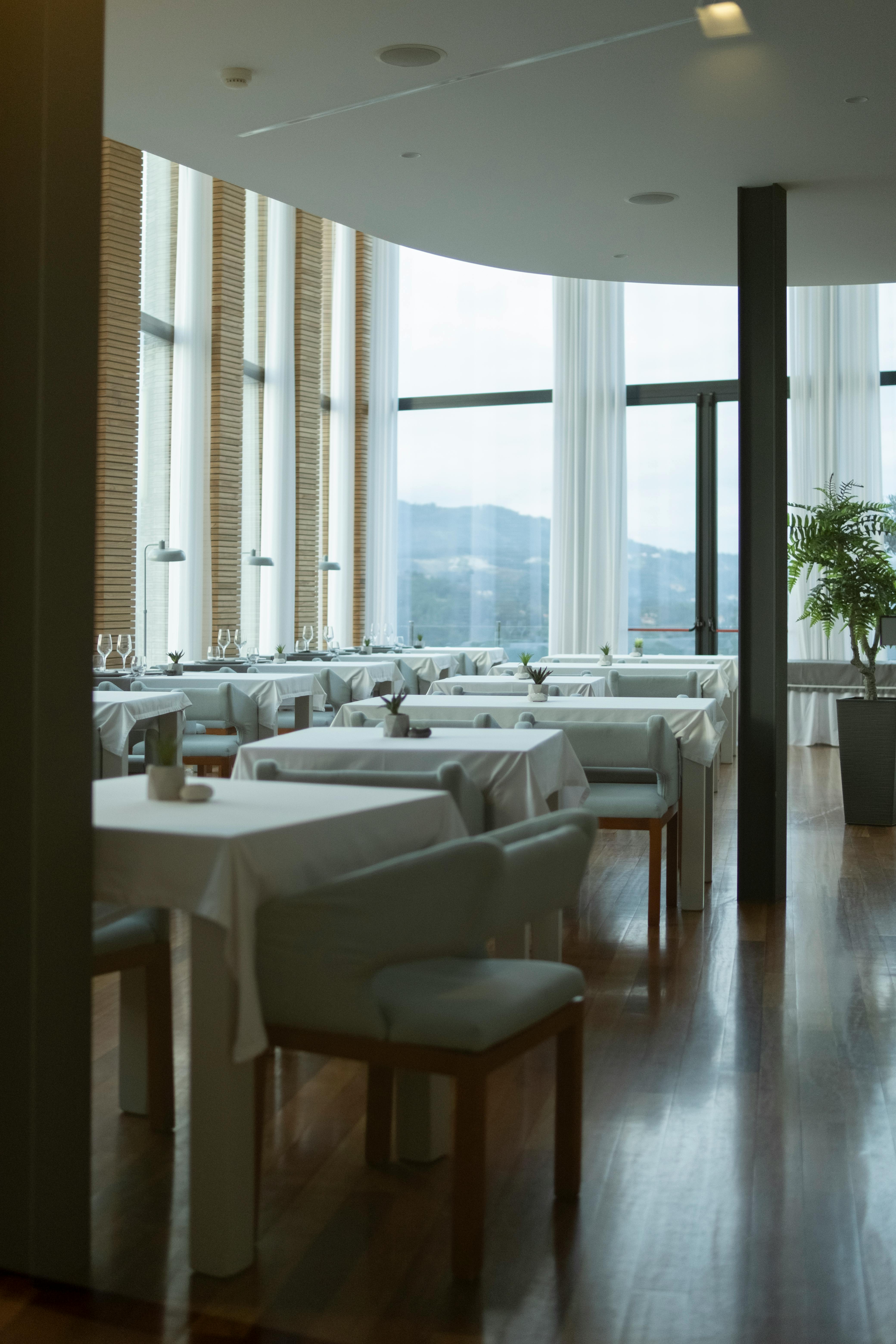 Tables near Restaurants Windows · Free Stock Photo