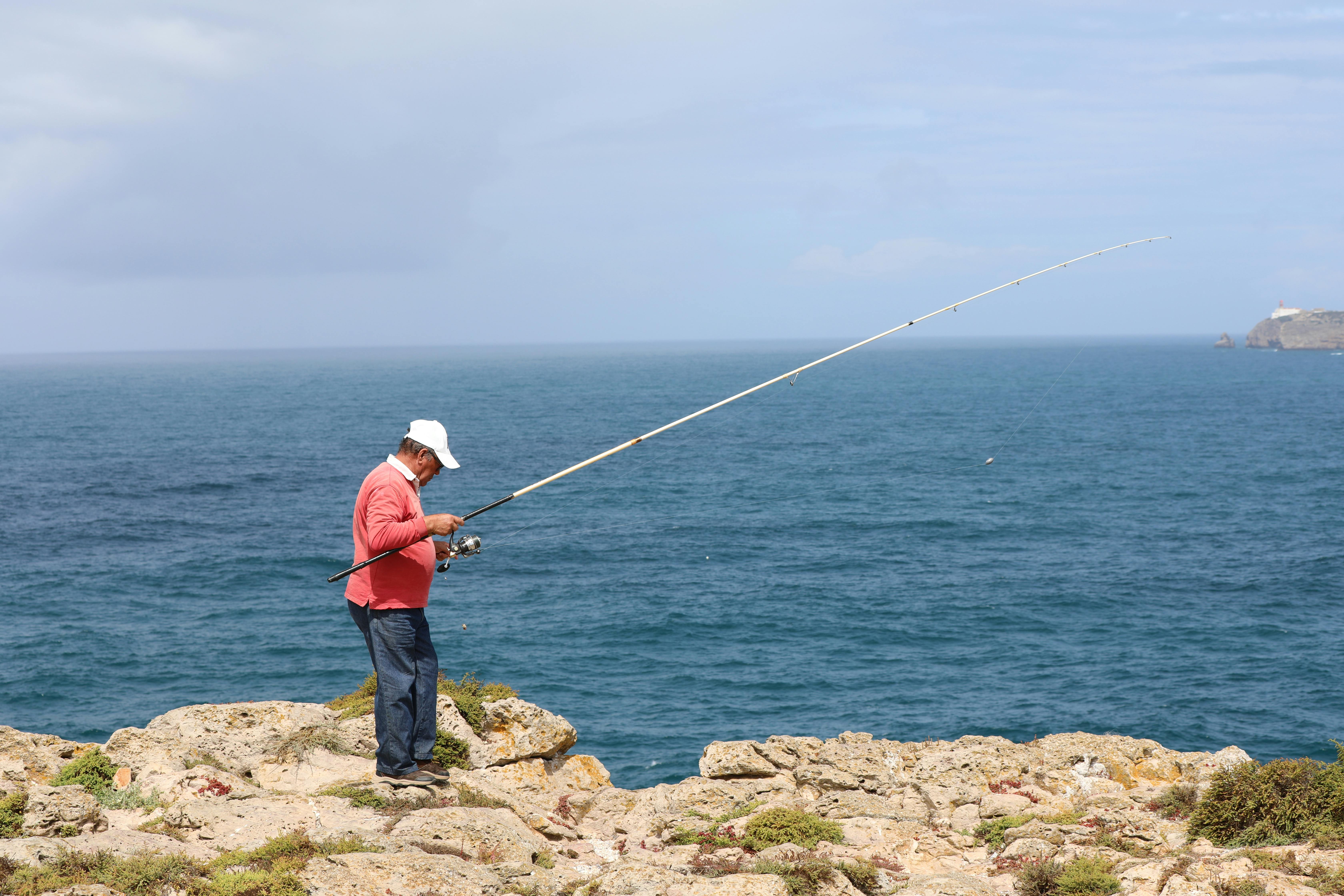 Man Fishing in the Sea · Free Stock Photo