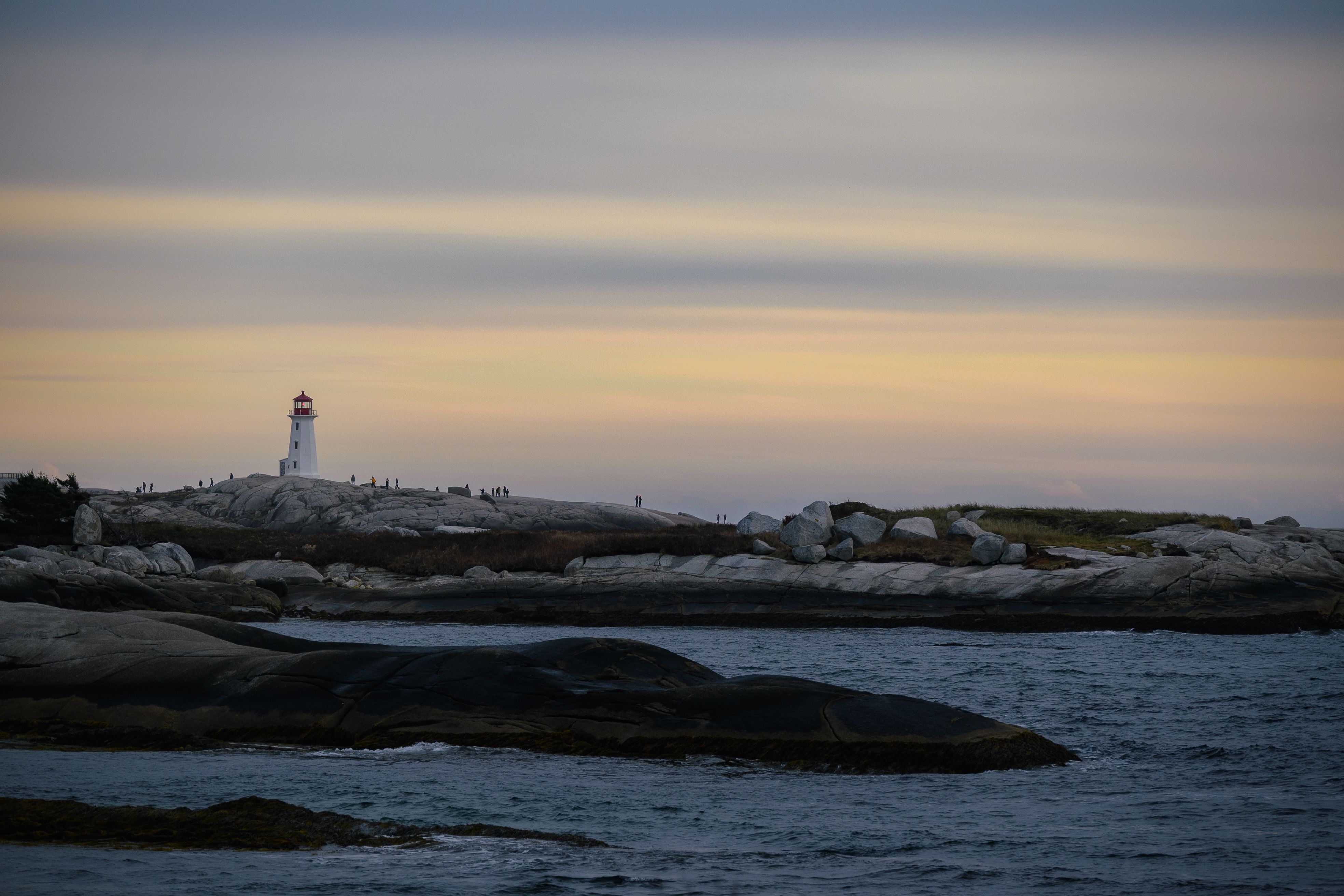 Sea Coast with Lighthouse at Sunset · Free Stock Photo