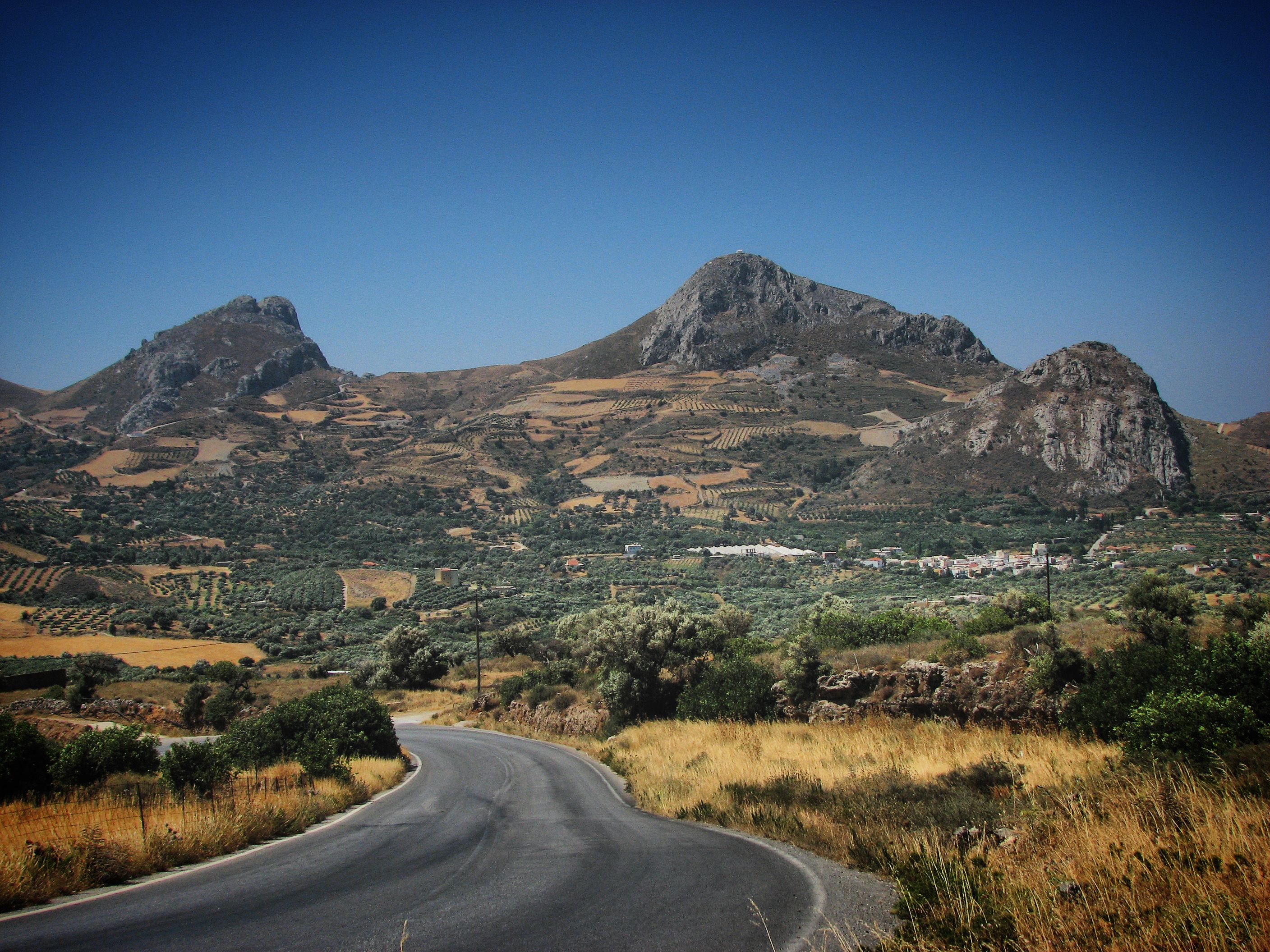Road and Hill behind · Free Stock Photo
