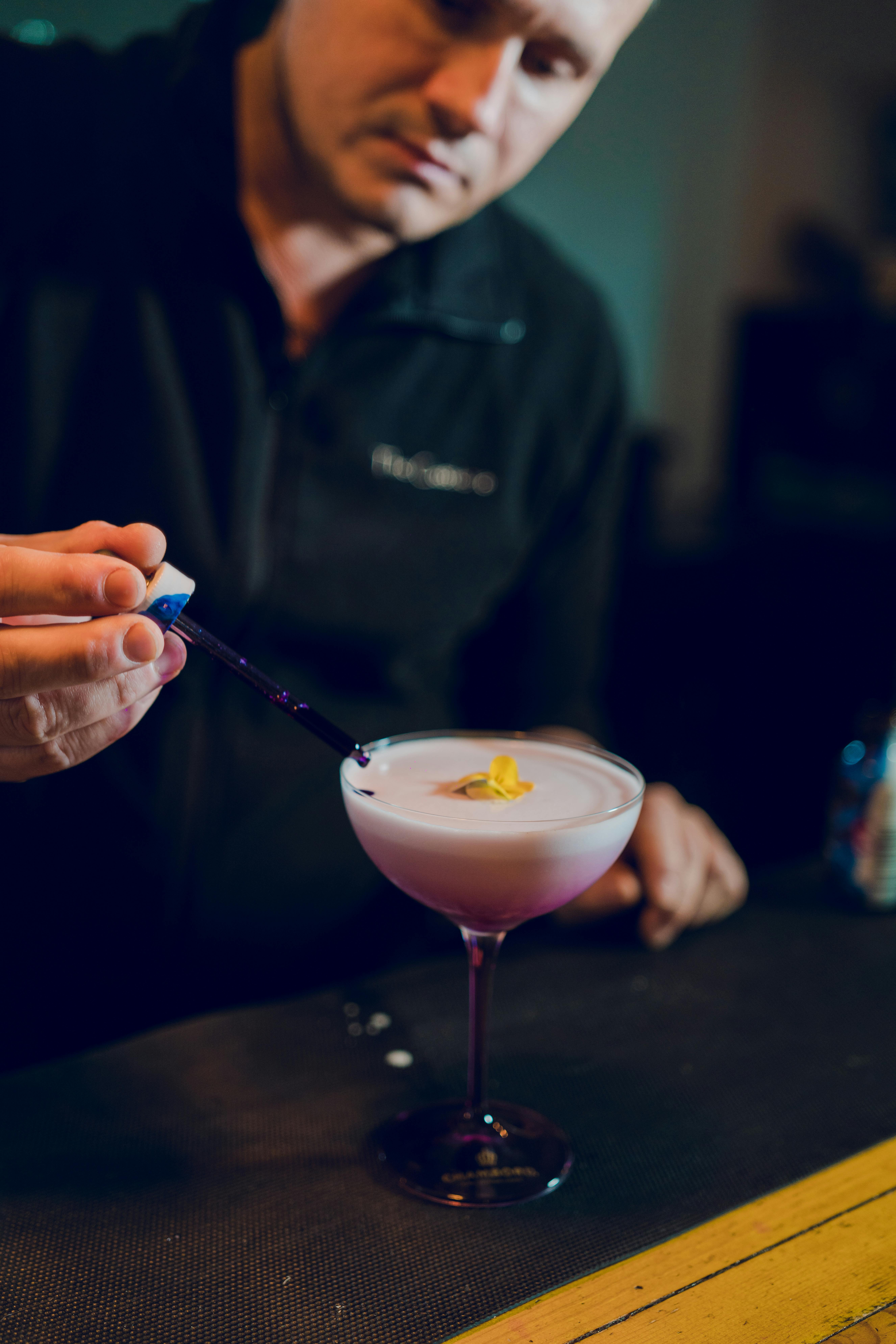 Man Holding Burner over Cocktail · Free Stock Photo