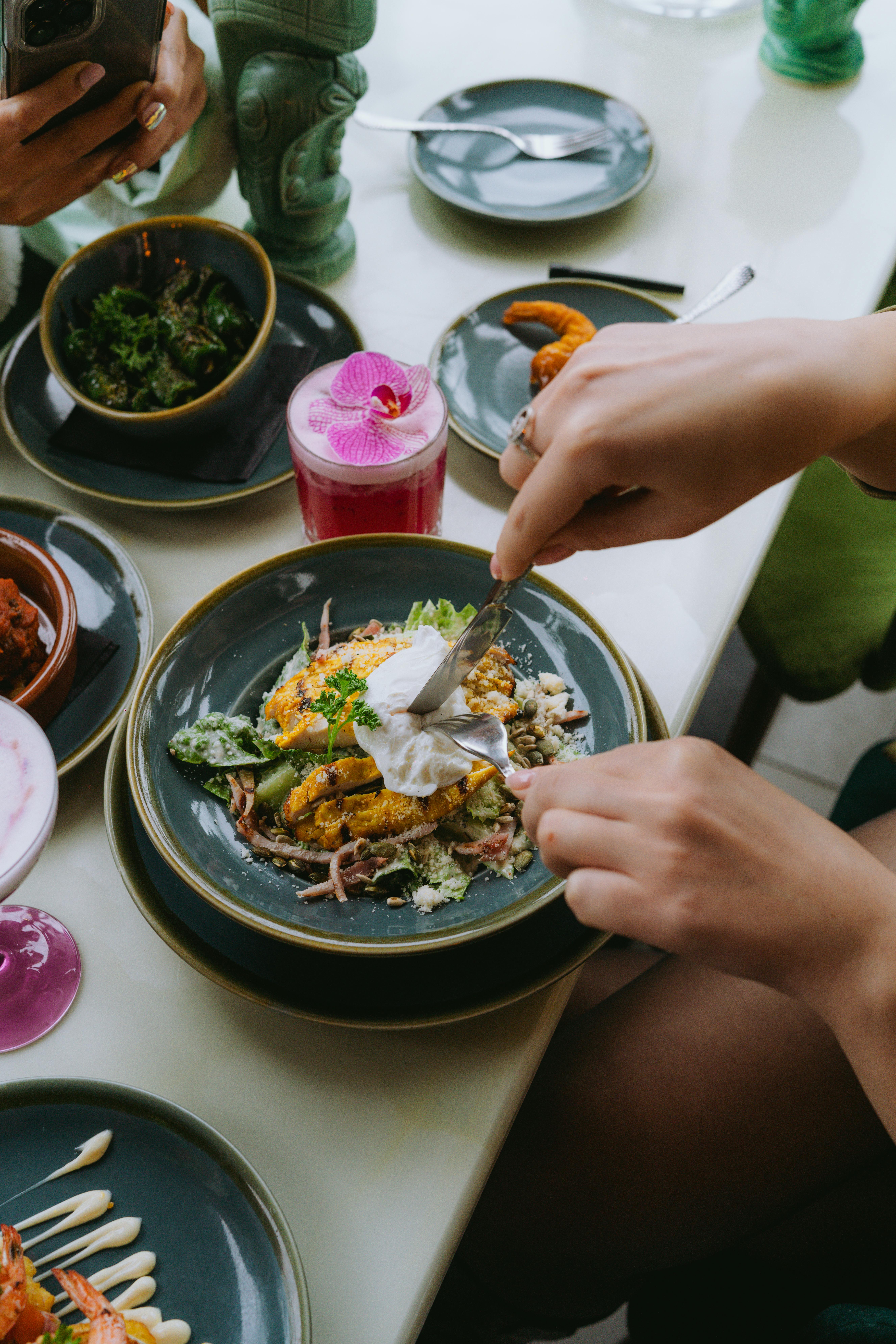 Hands of Woman Eating Dinner in Restaurant · Free Stock Photo