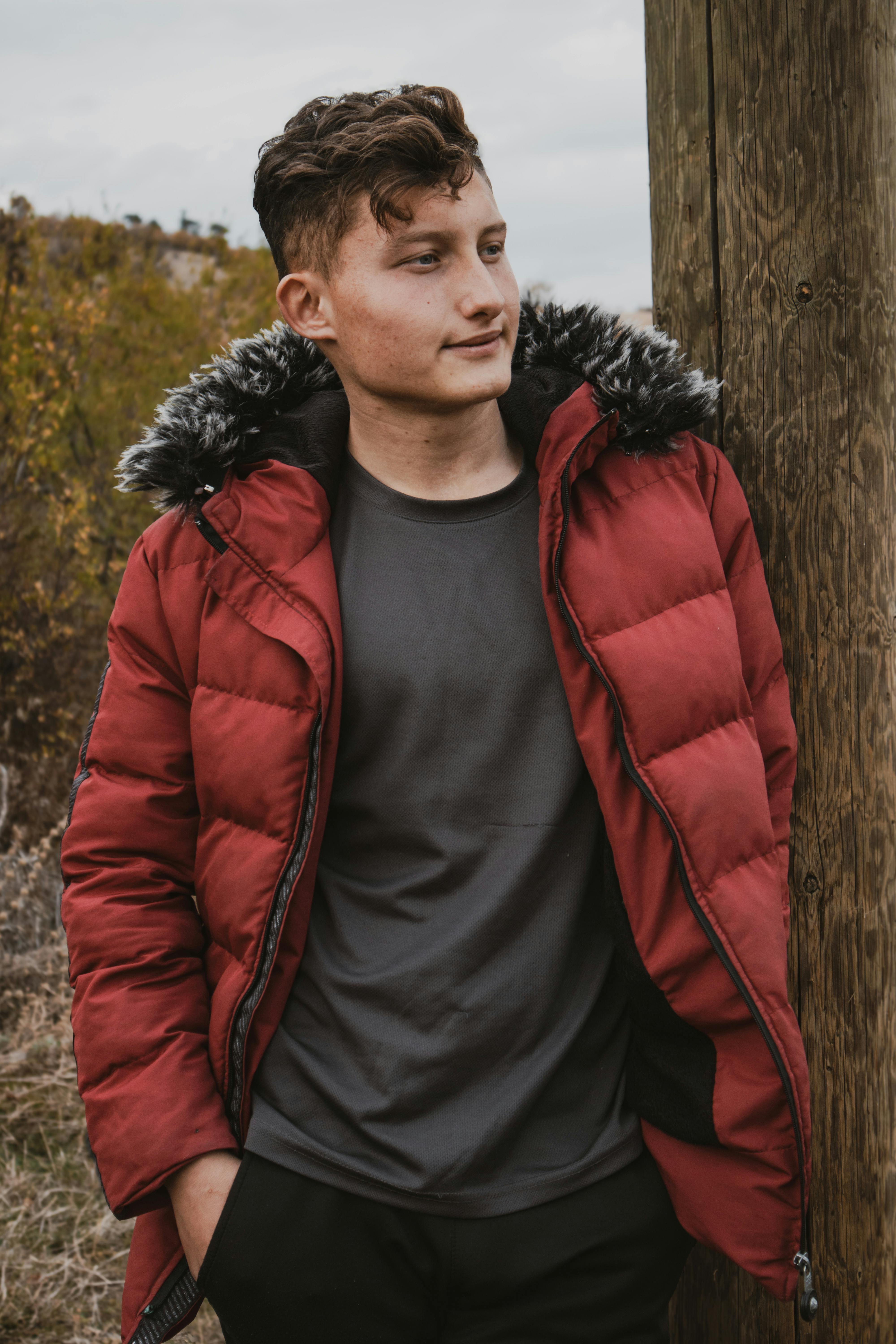 Man Wearing Red Jacket on a Field · Free Stock Photo