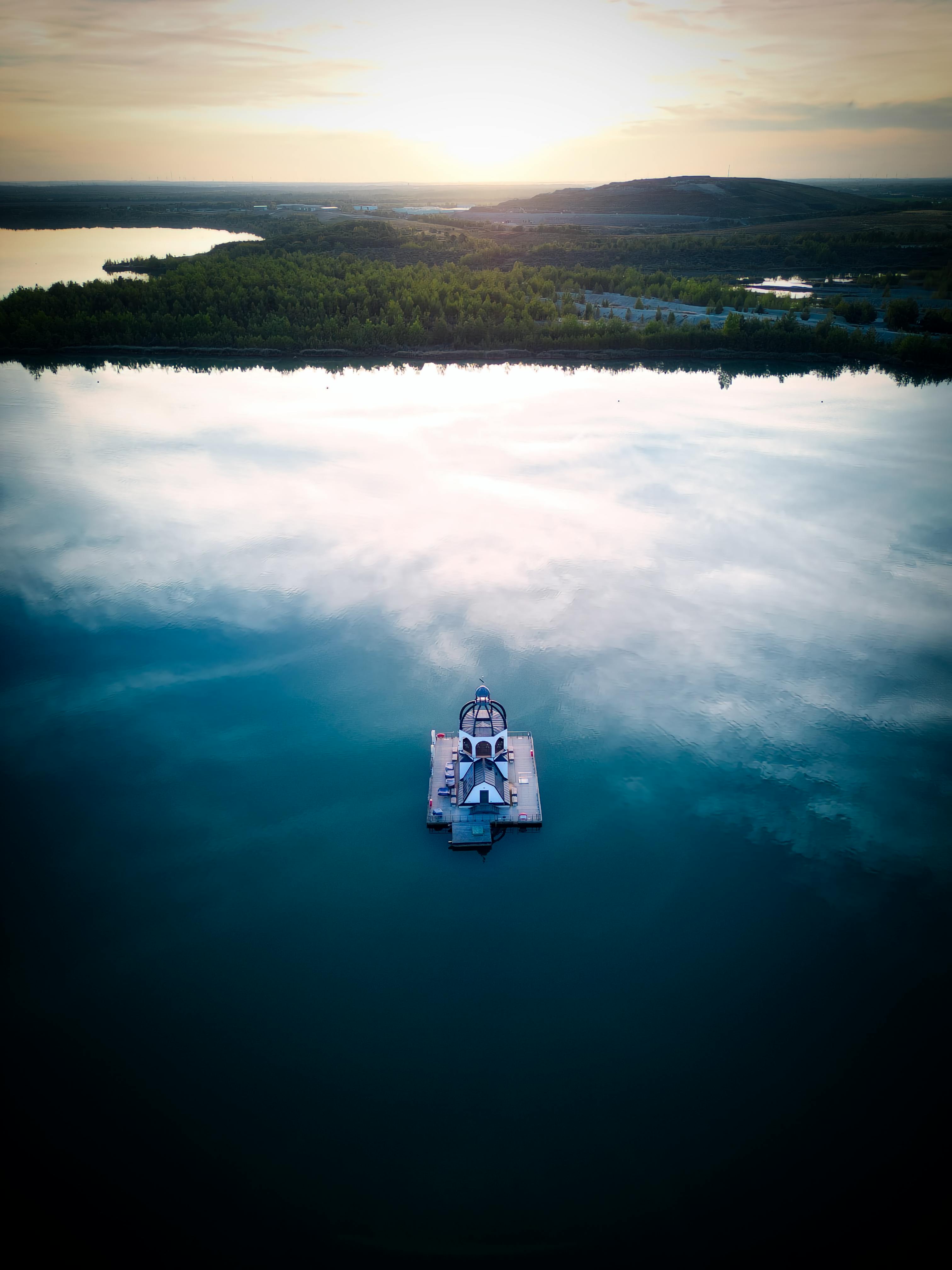 Aerial Footage of a Lake and a Floating Construction · Free Stock Photo