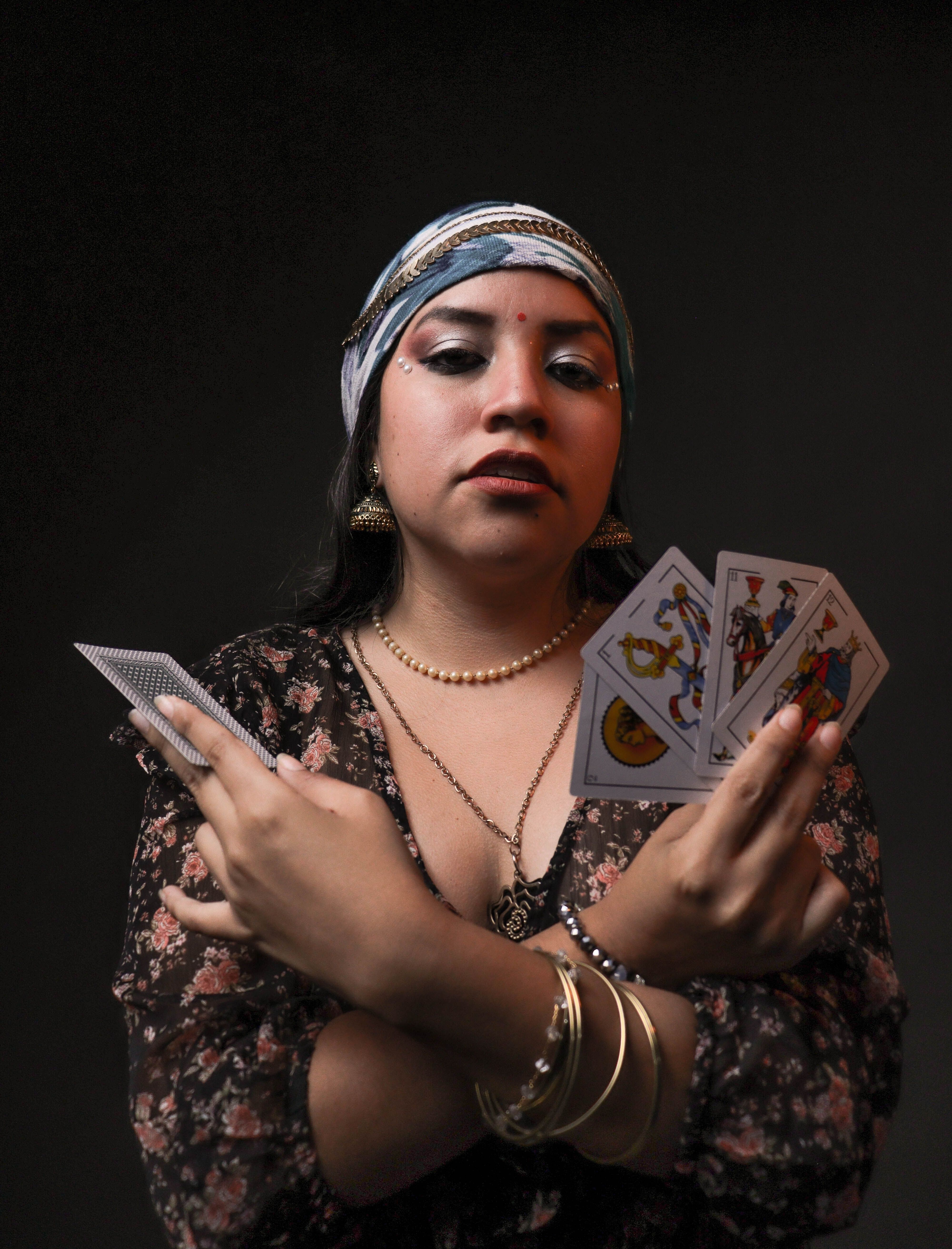 Portrait of Woman Holding Tarot Cards in Hands · Free Stock Photo