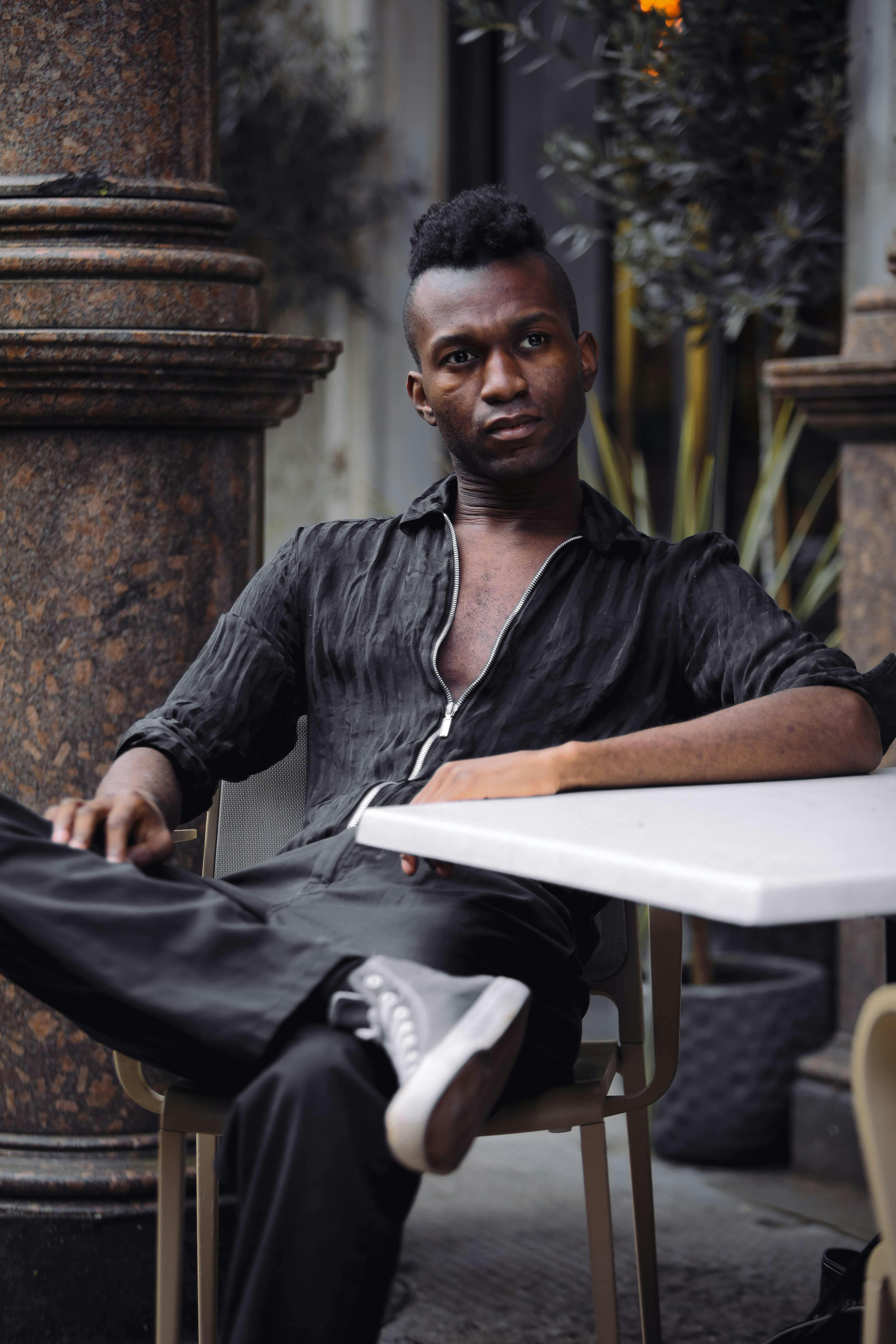 Man Sitting at the Table Outside · Free Stock Photo