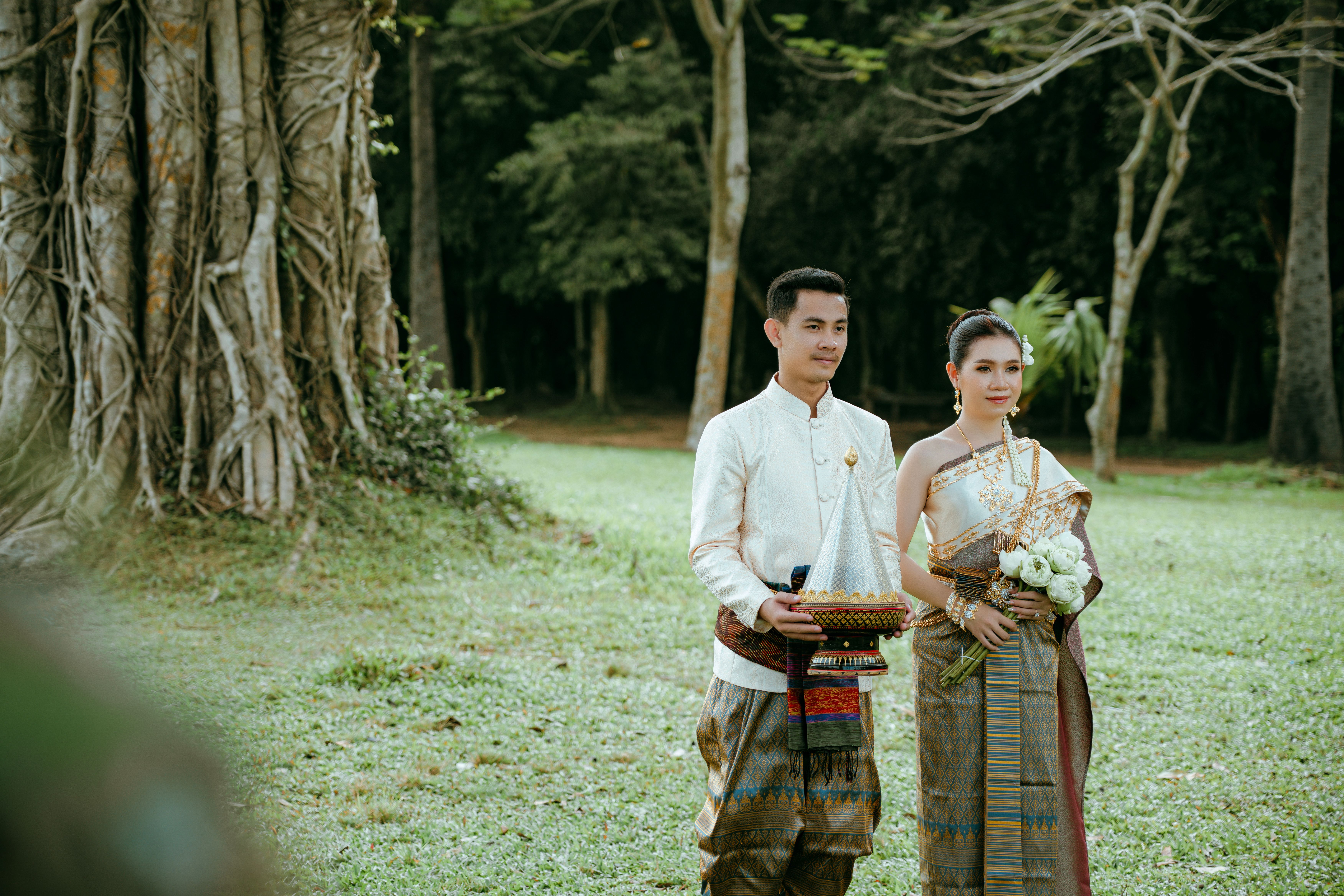 Bride and Groom in Traditional Clothing Standing on a Meadow · Free ...