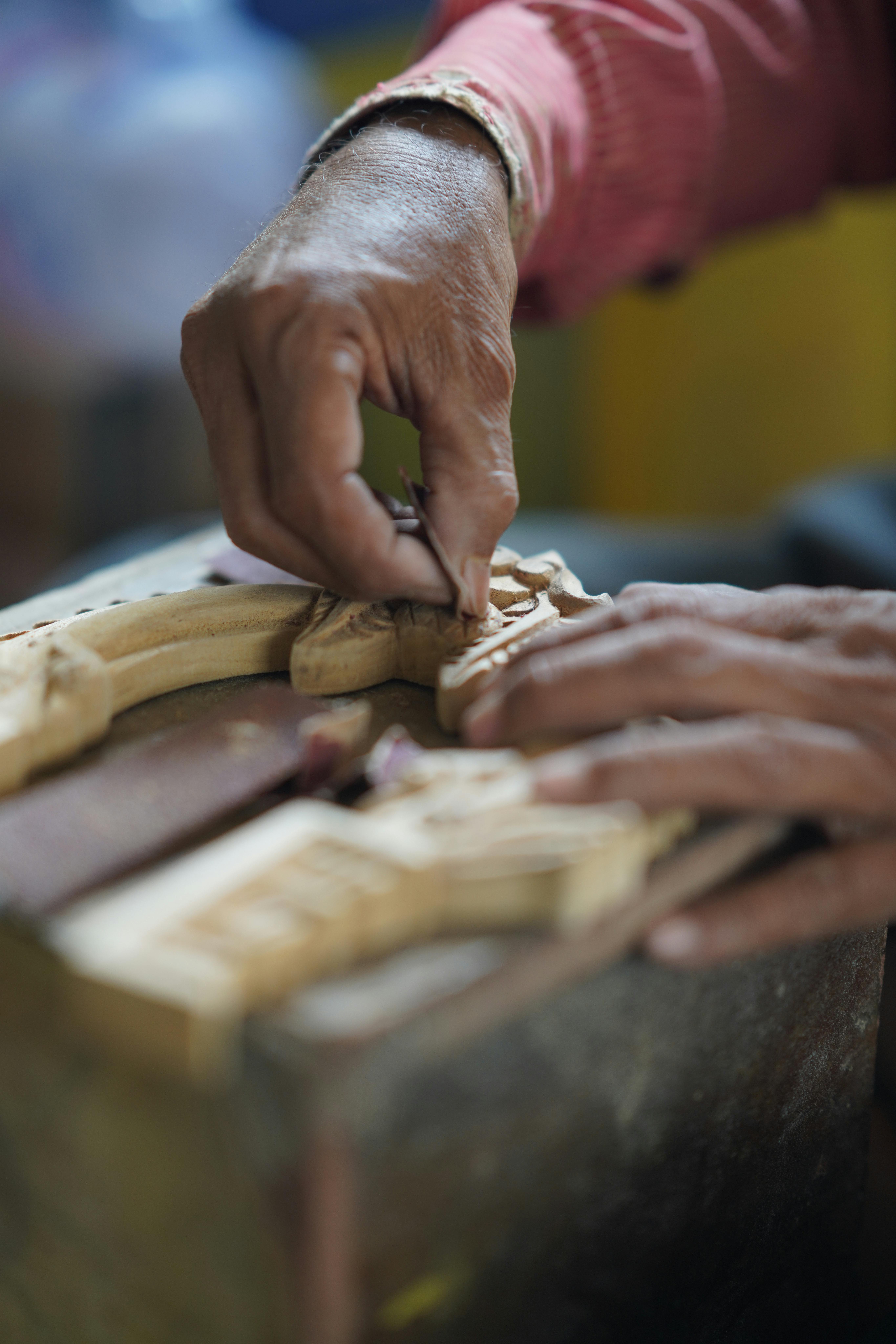 Artisan Sculpting in Wood · Free Stock Photo