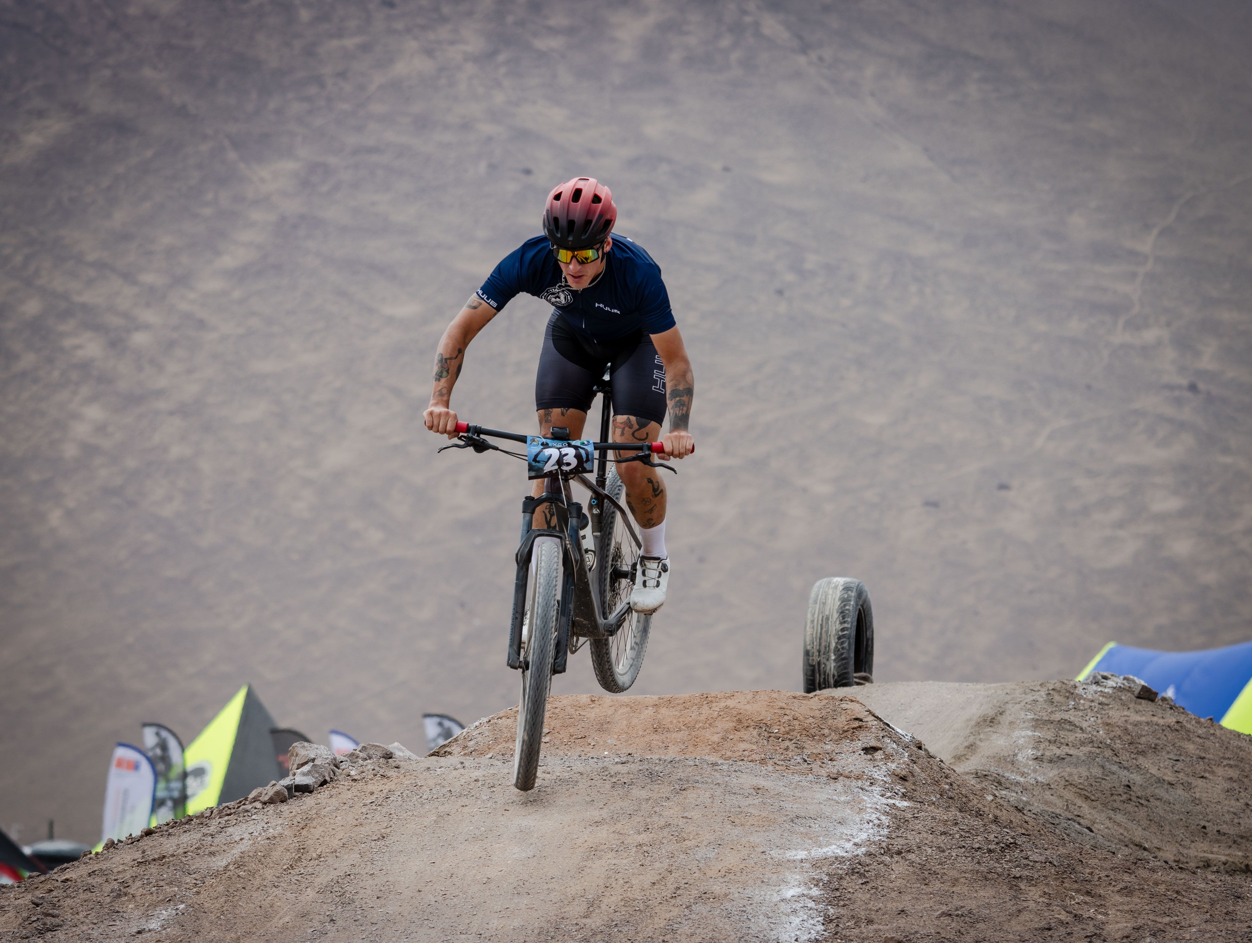Man Riding a Bike on a Desert · Free Stock Photo