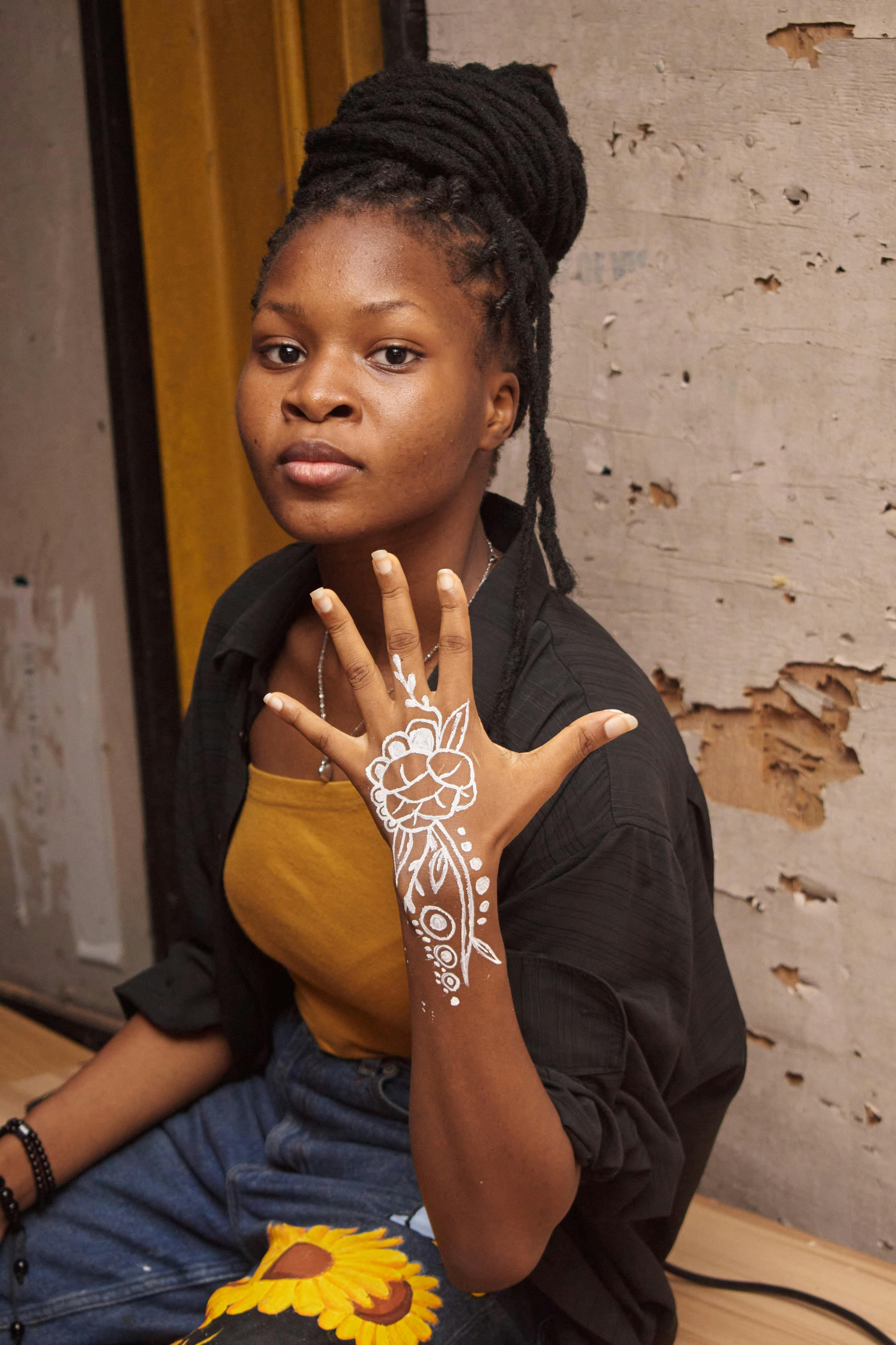 A Woman Presenting Hand Henna · Free Stock Photo