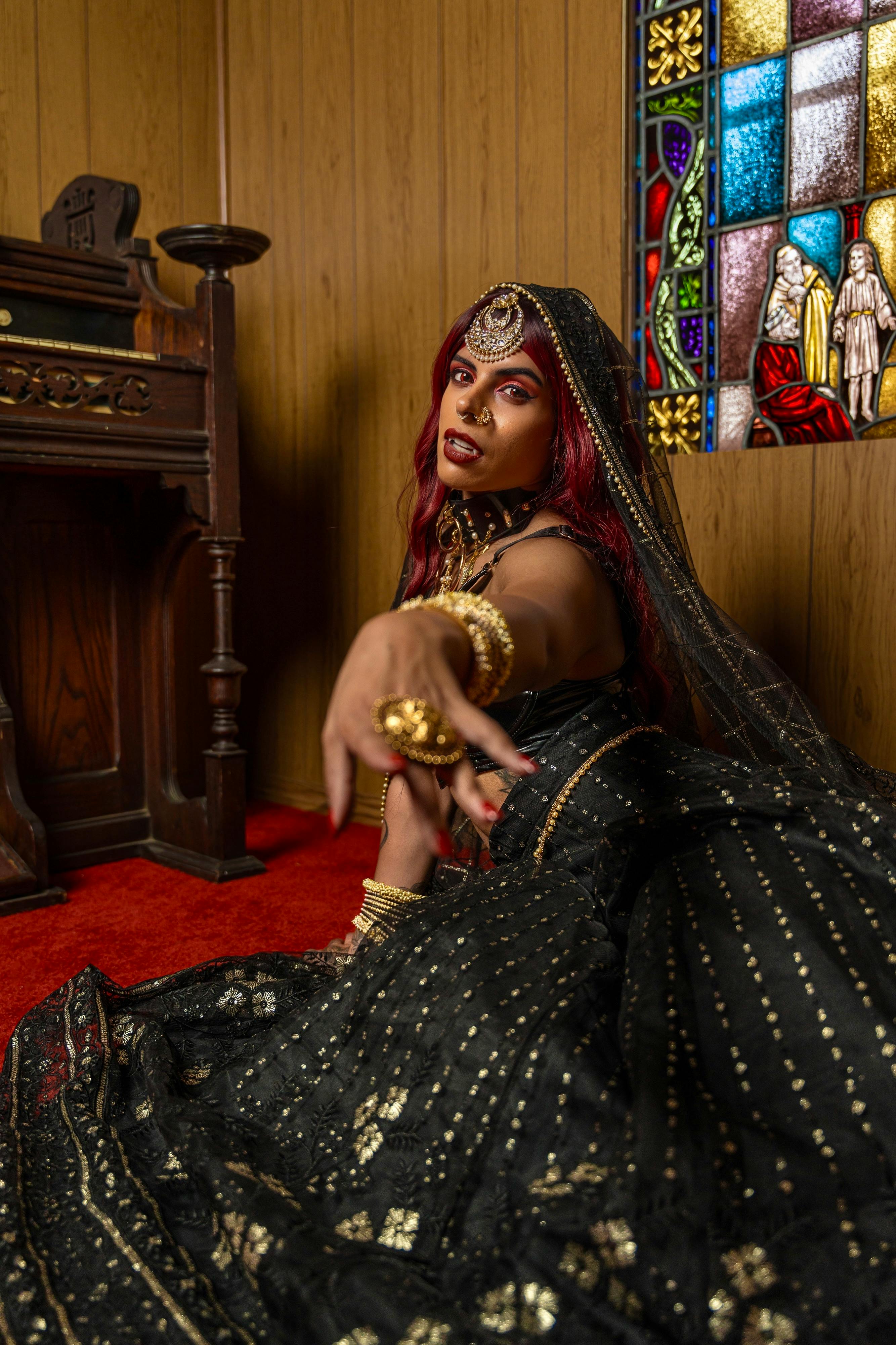 Vampire Sitting on the Floor in a Church · Free Stock Photo