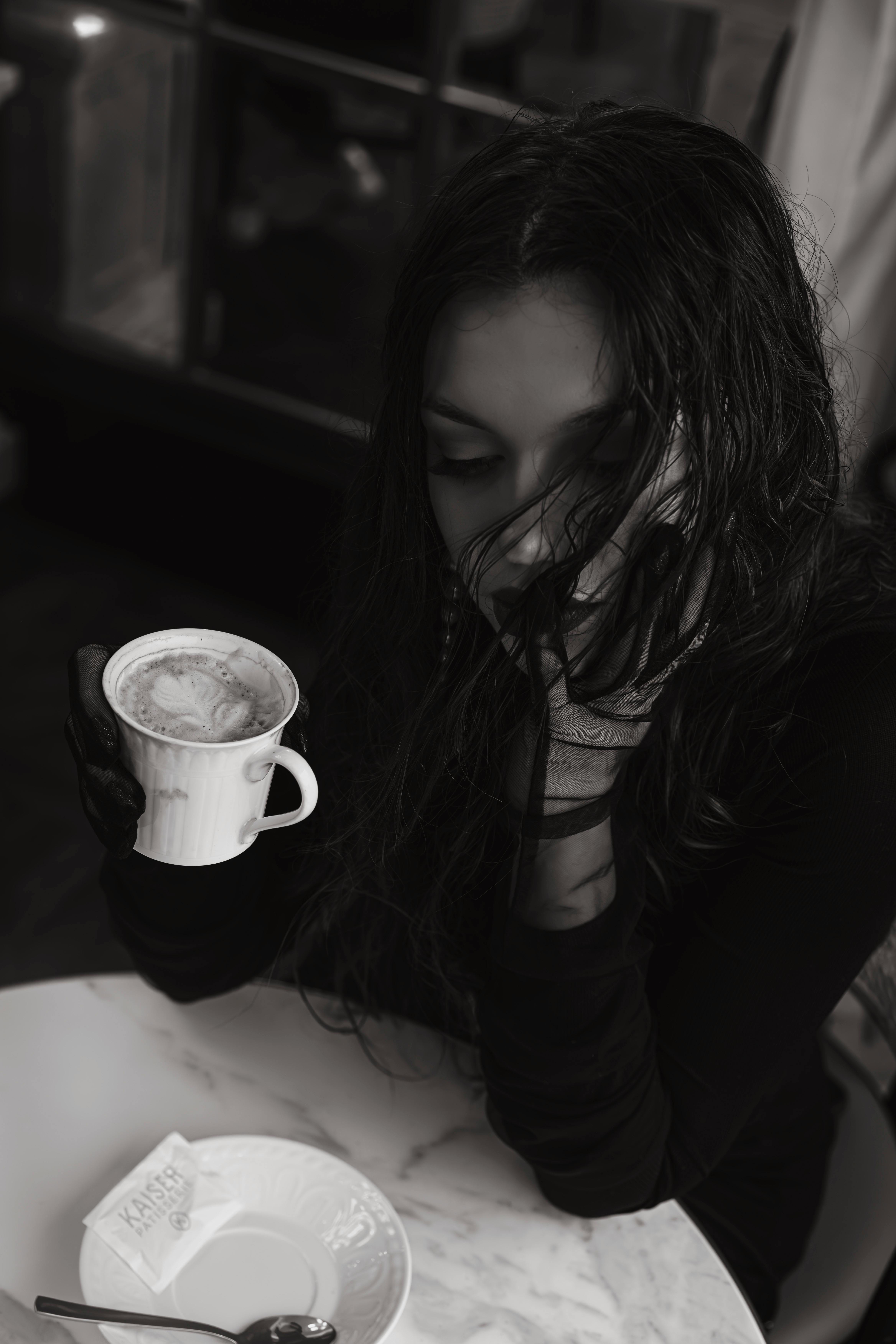 Woman Sitting at Cafe Table Reading Book · Free Stock Photo