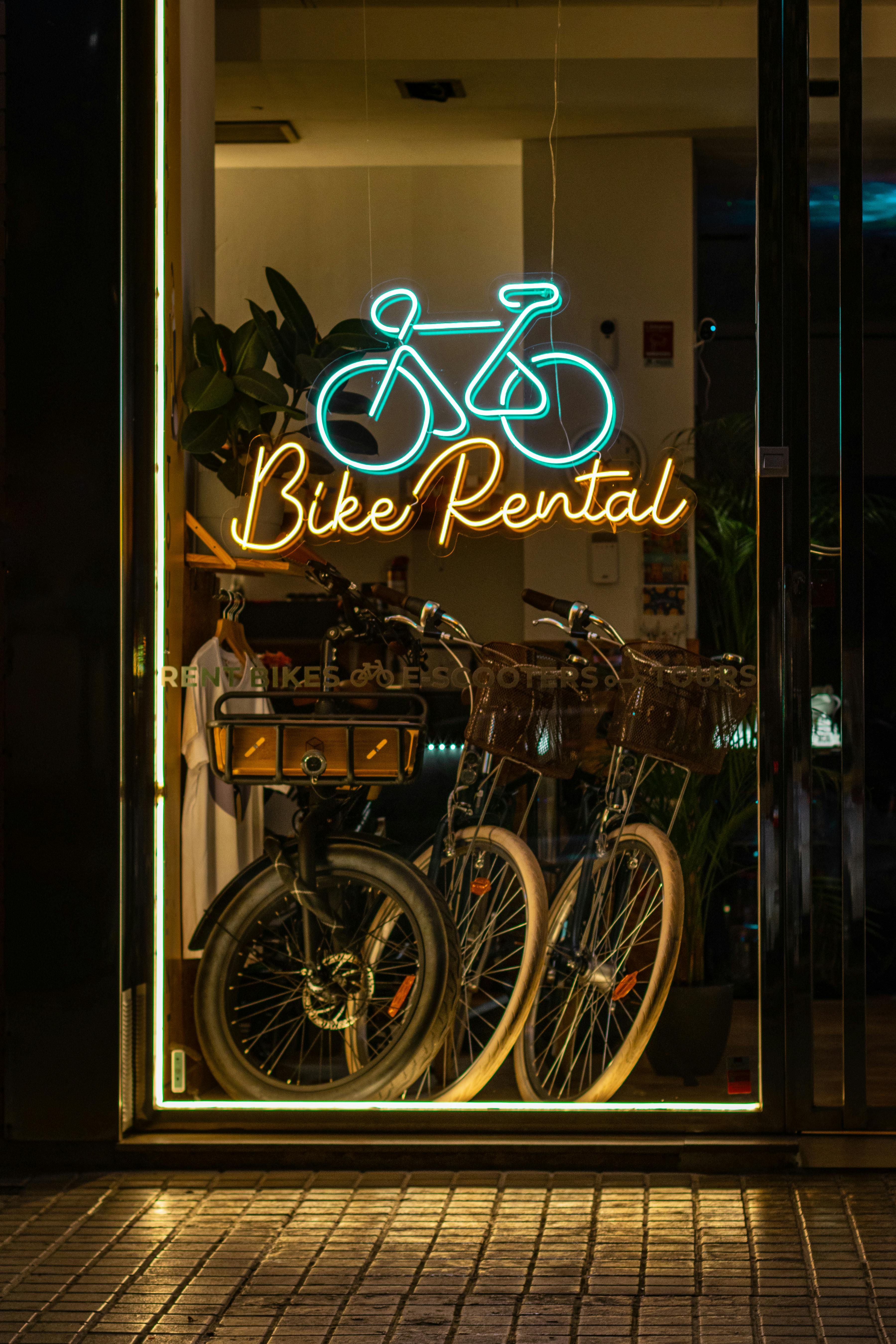 Neon Sign of a Bike Rental Shop · Free Stock Photo