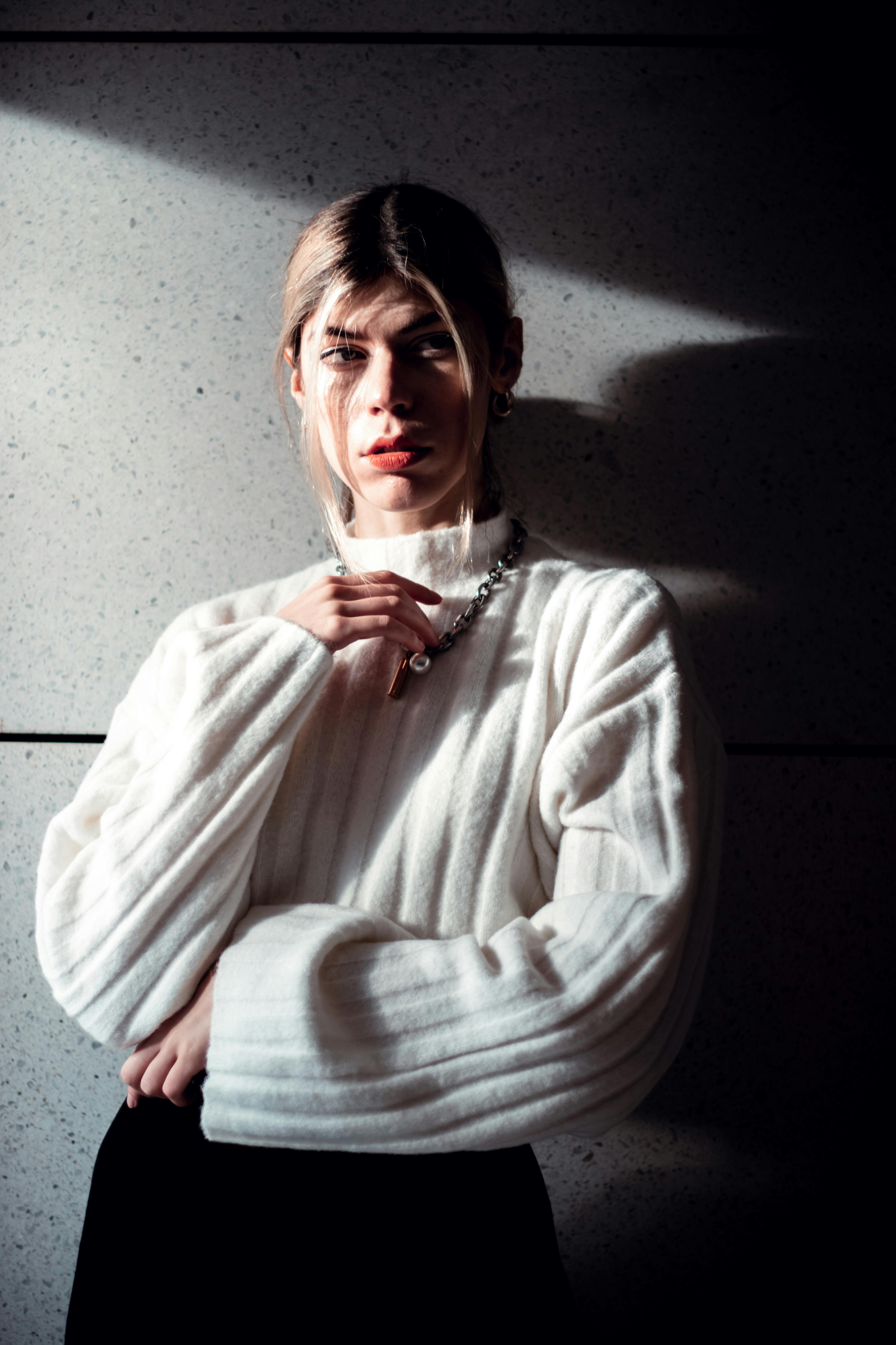 A Woman in Pilot Uniform Standing Infront of Helicopter · Free Stock Photo