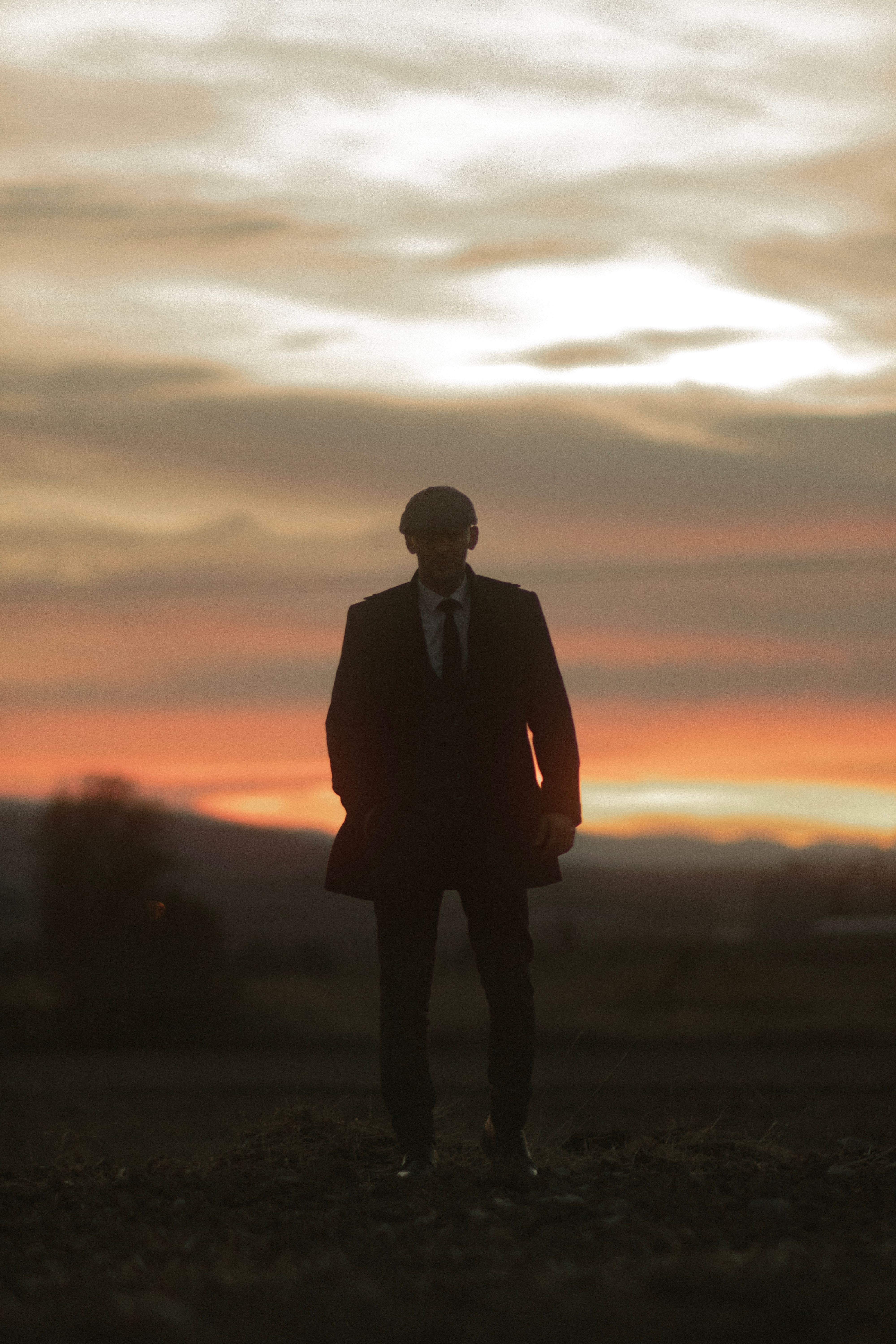 Man in Suit Standing in Lake · Free Stock Photo