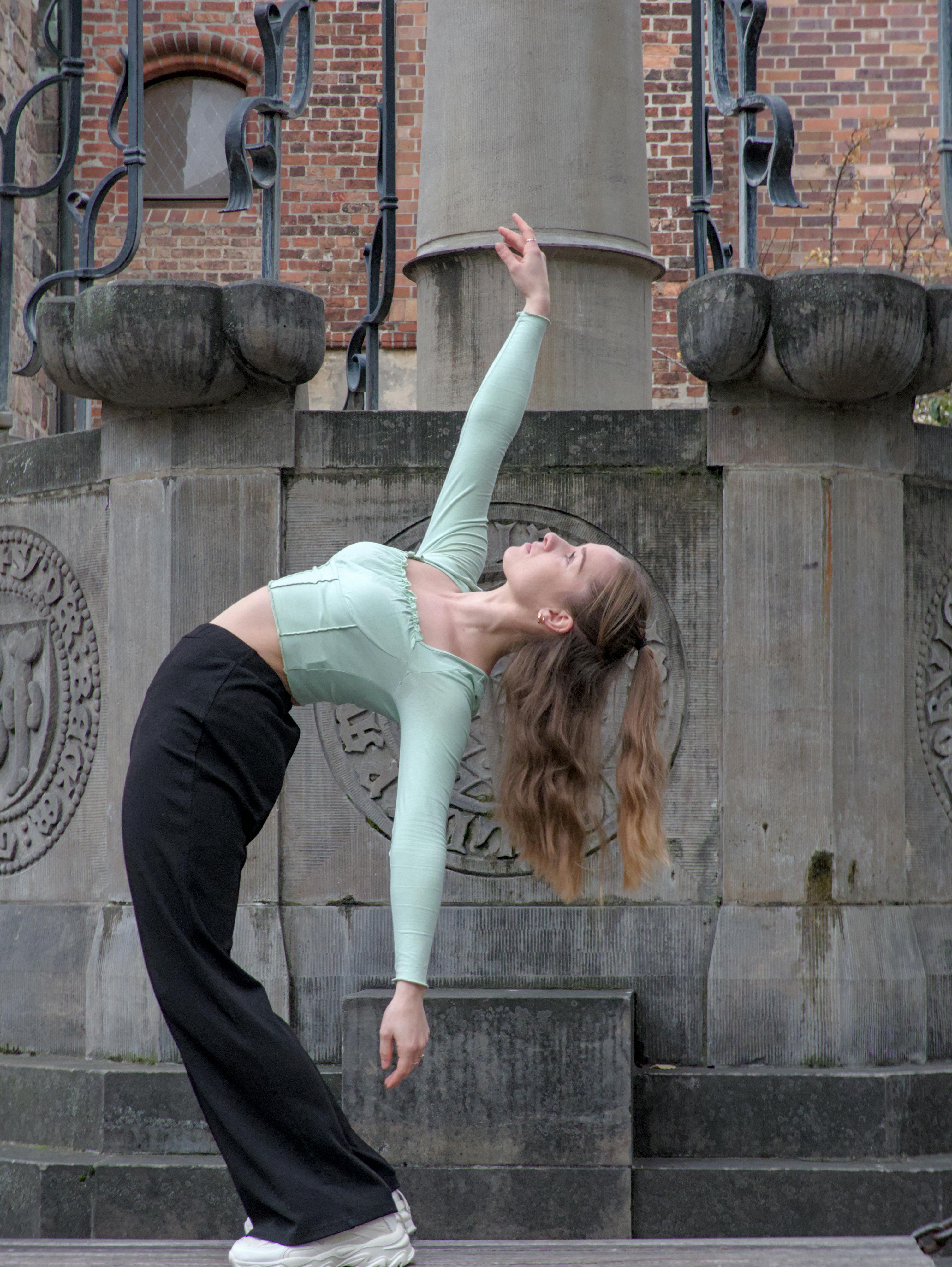 Young Woman Bending Backwards while Dancing Outside · Free Stock Photo