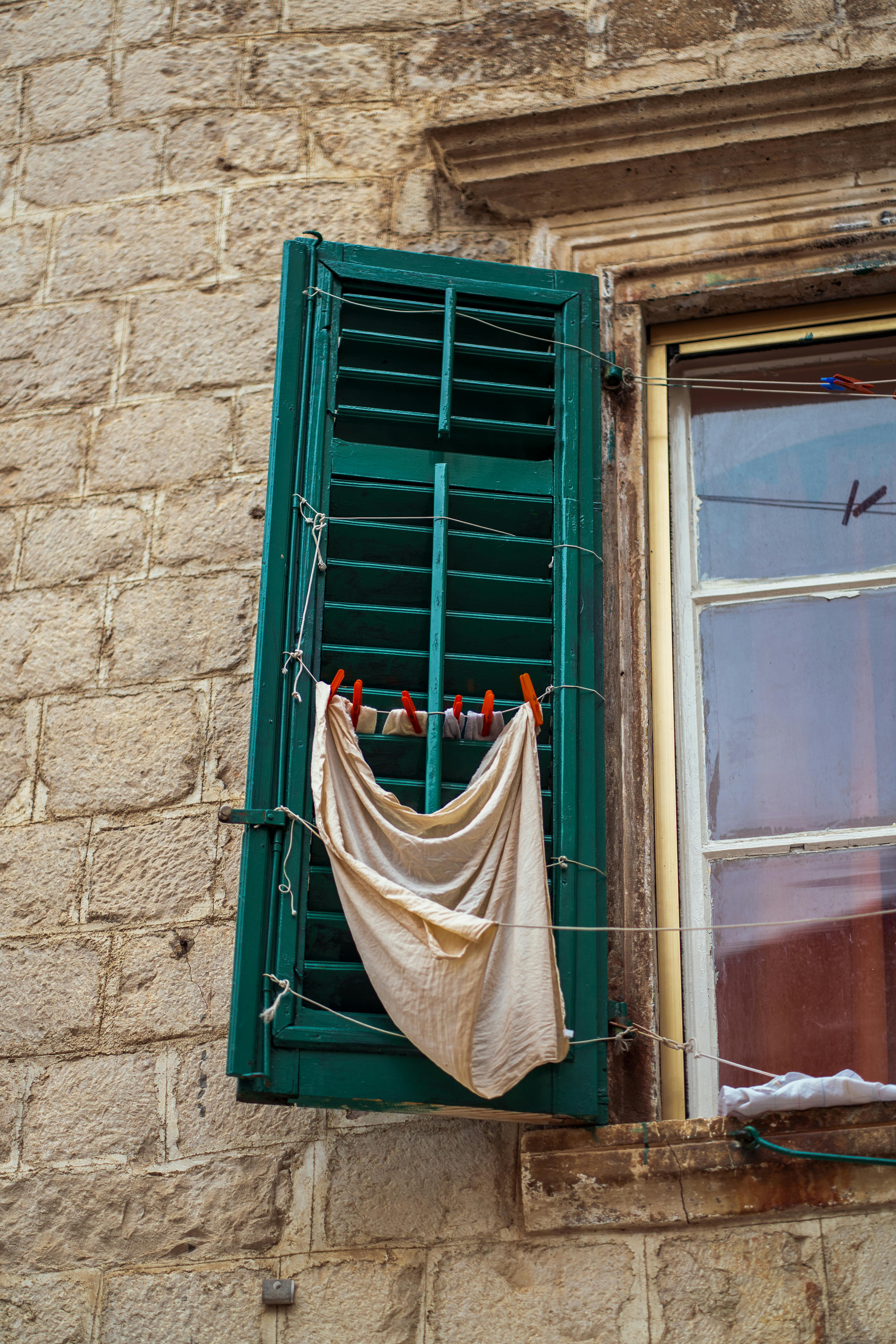 Cloth Drying on Window Shutter · Free Stock Photo
