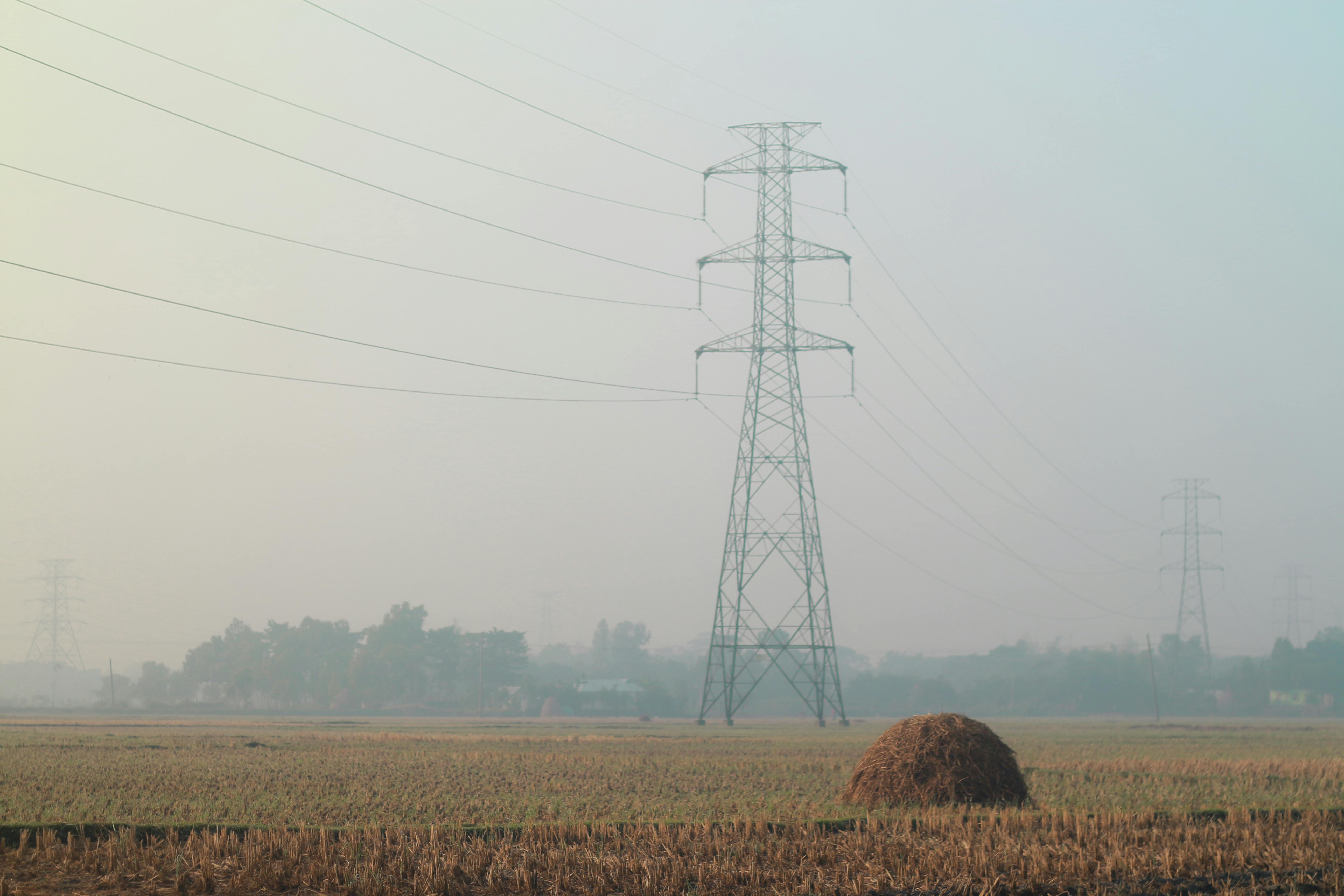 Transmission Tower on Rural Field · Free Stock Photo