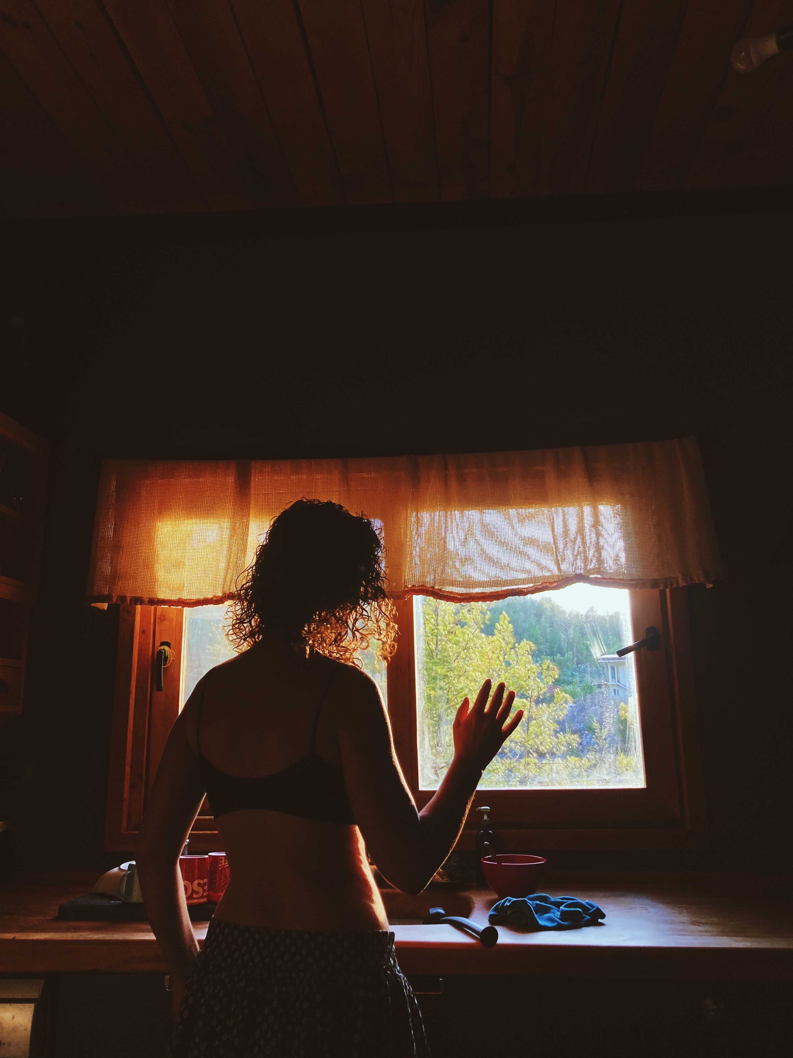 Woman Standing by the Window in a House · Free Stock Photo