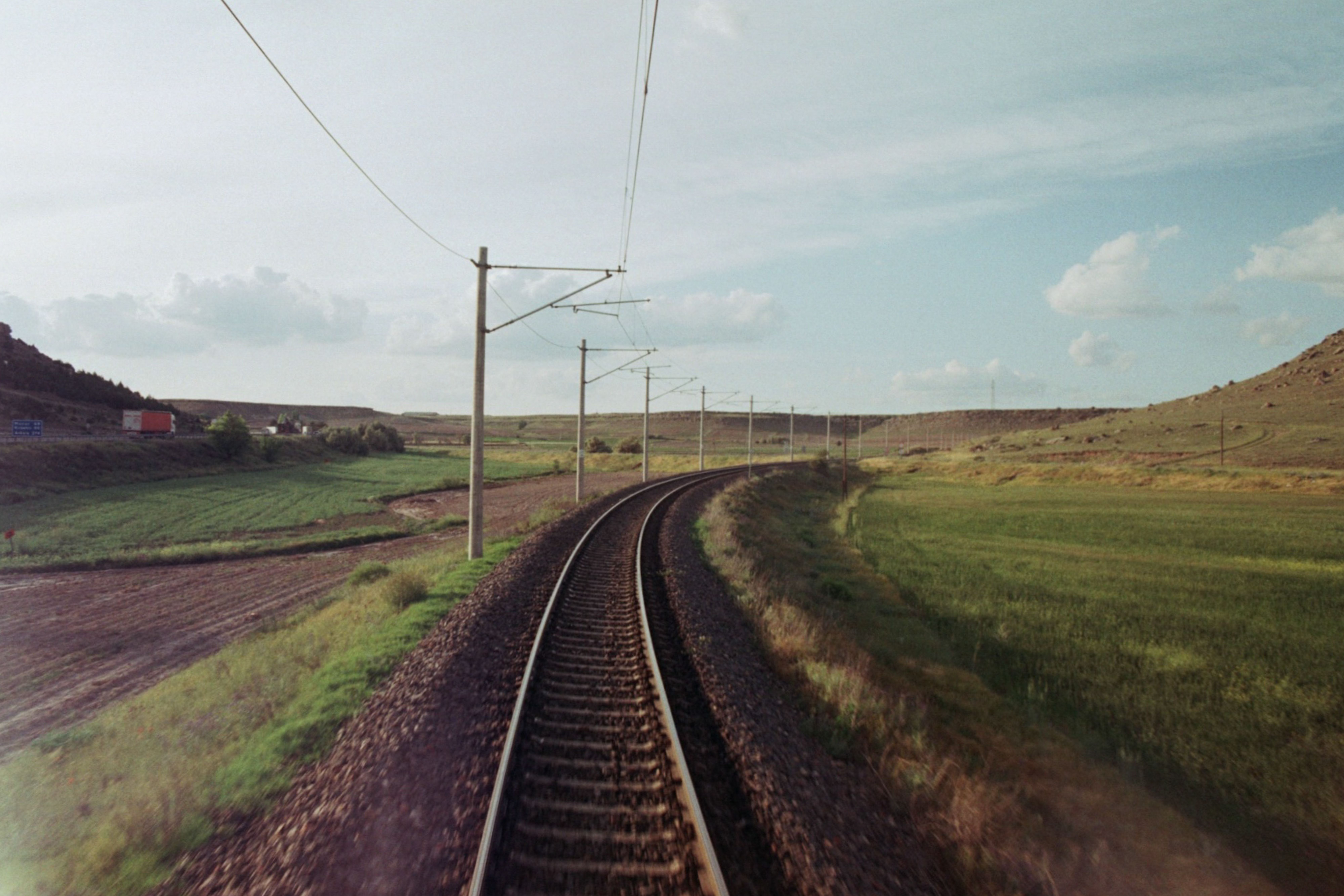 Railway Tracks Passing through the Fields · Free Stock Photo