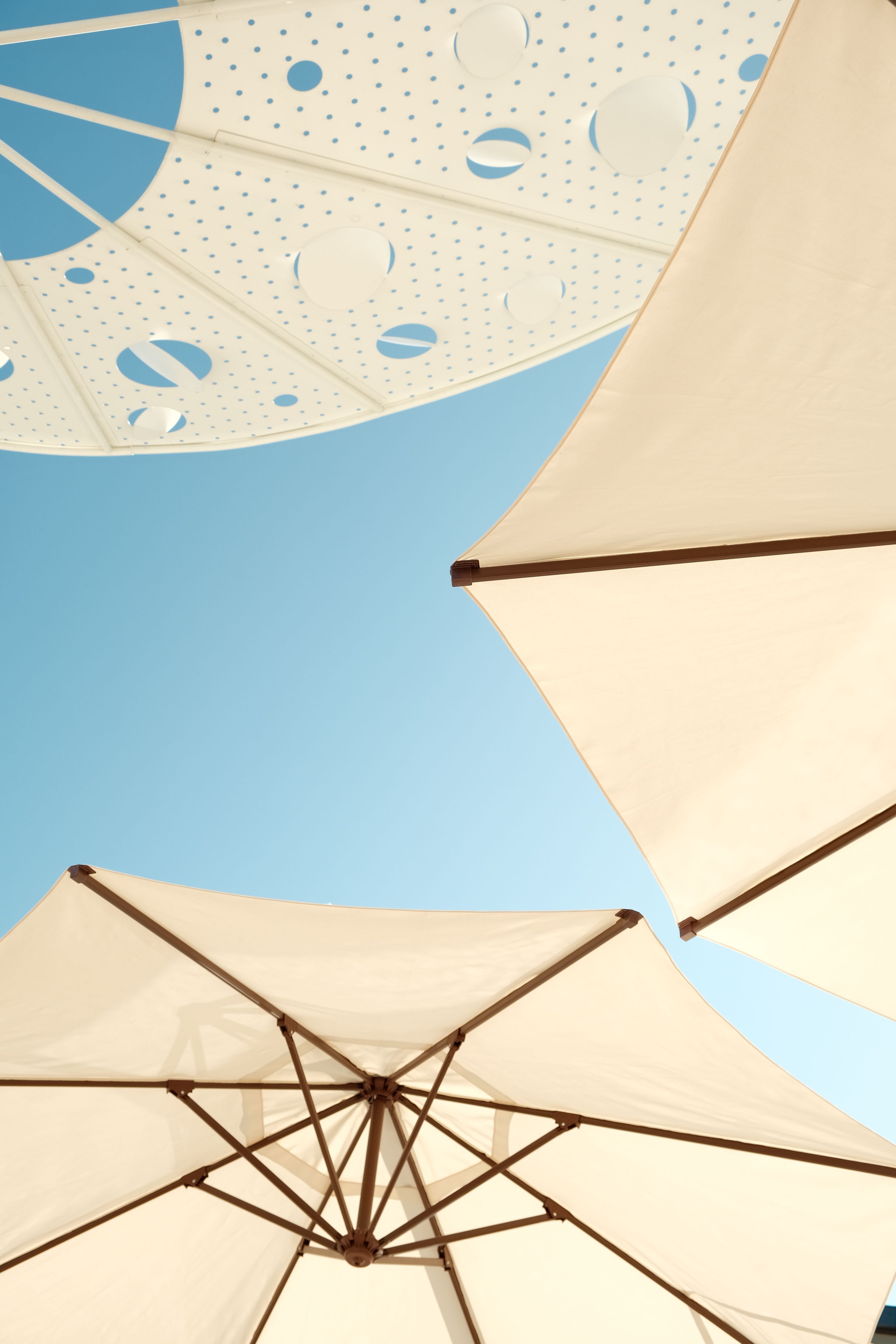 Low Angle Shot of Sunshades · Free Stock Photo