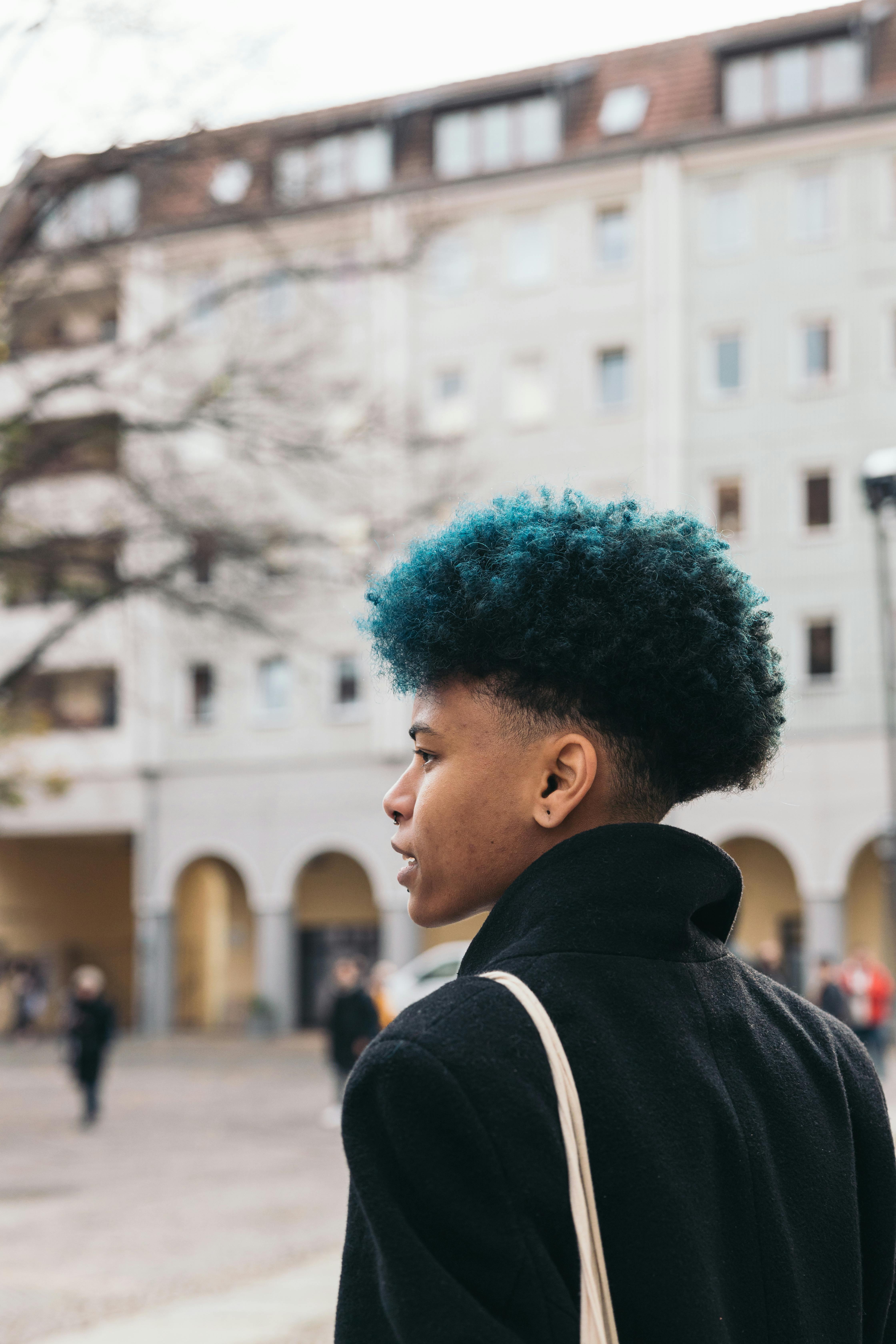 A Young Person with Blue Afro Hair Walking on a Street in City · Free ...