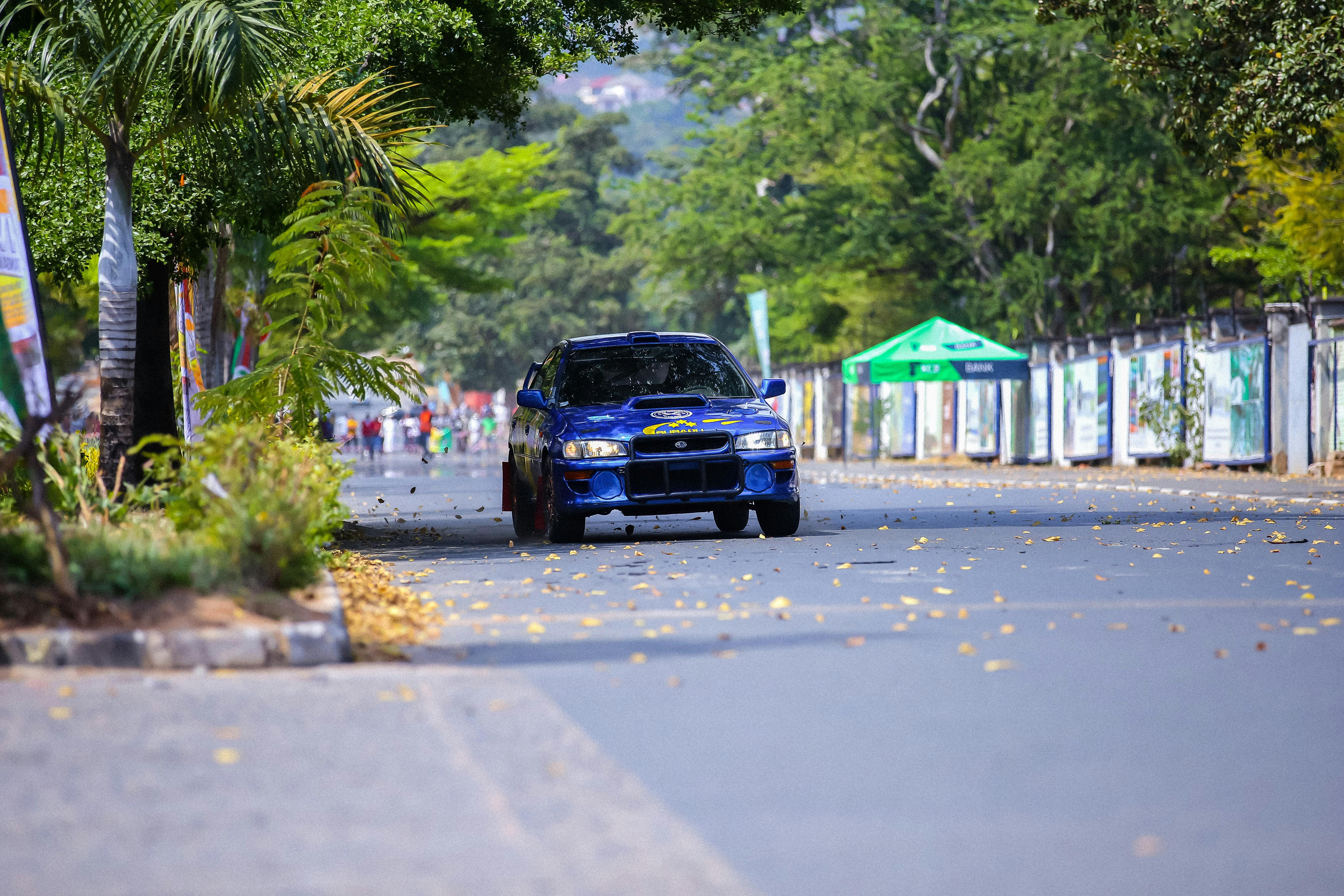 Blue Sports Car Racing on the Road in a City · Free Stock Photo