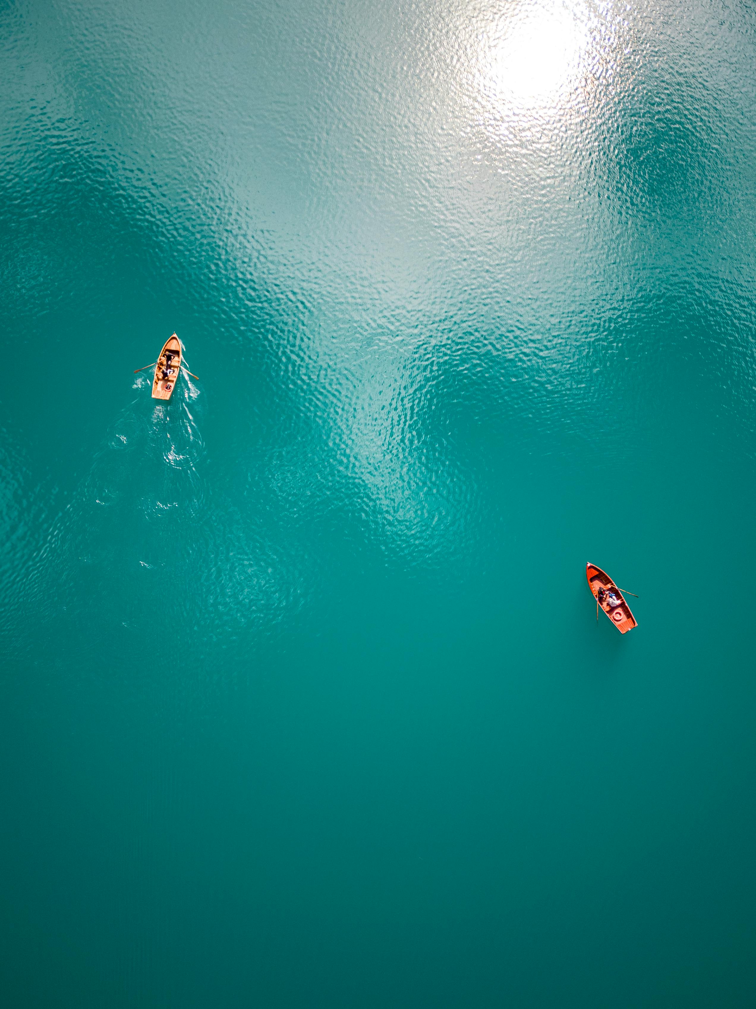 Aerial Photo of Two Row Boats Sailing on a Turquoise Lake · Free Stock ...