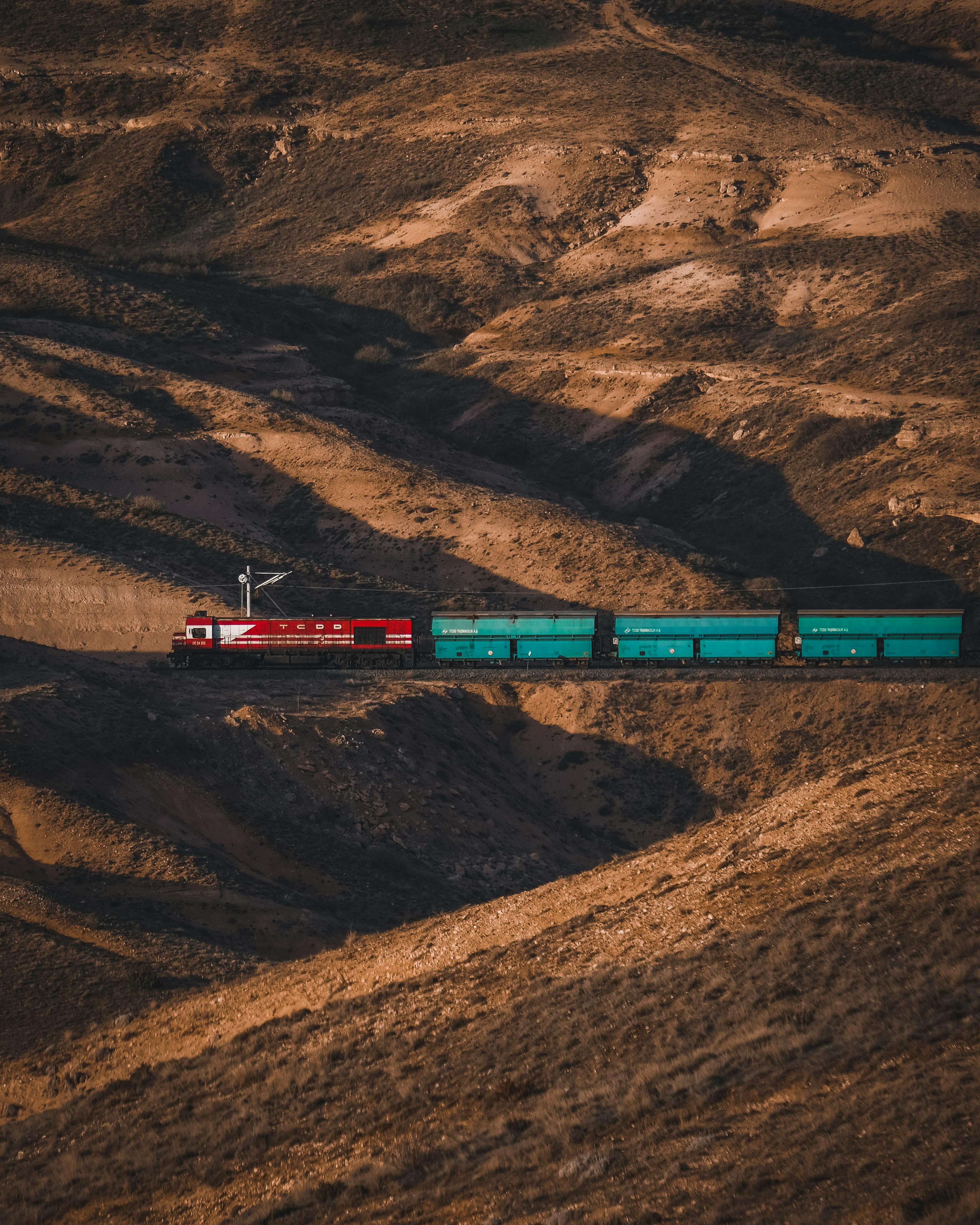 Aerial View of a Train Riding through a Desert · Free Stock Photo