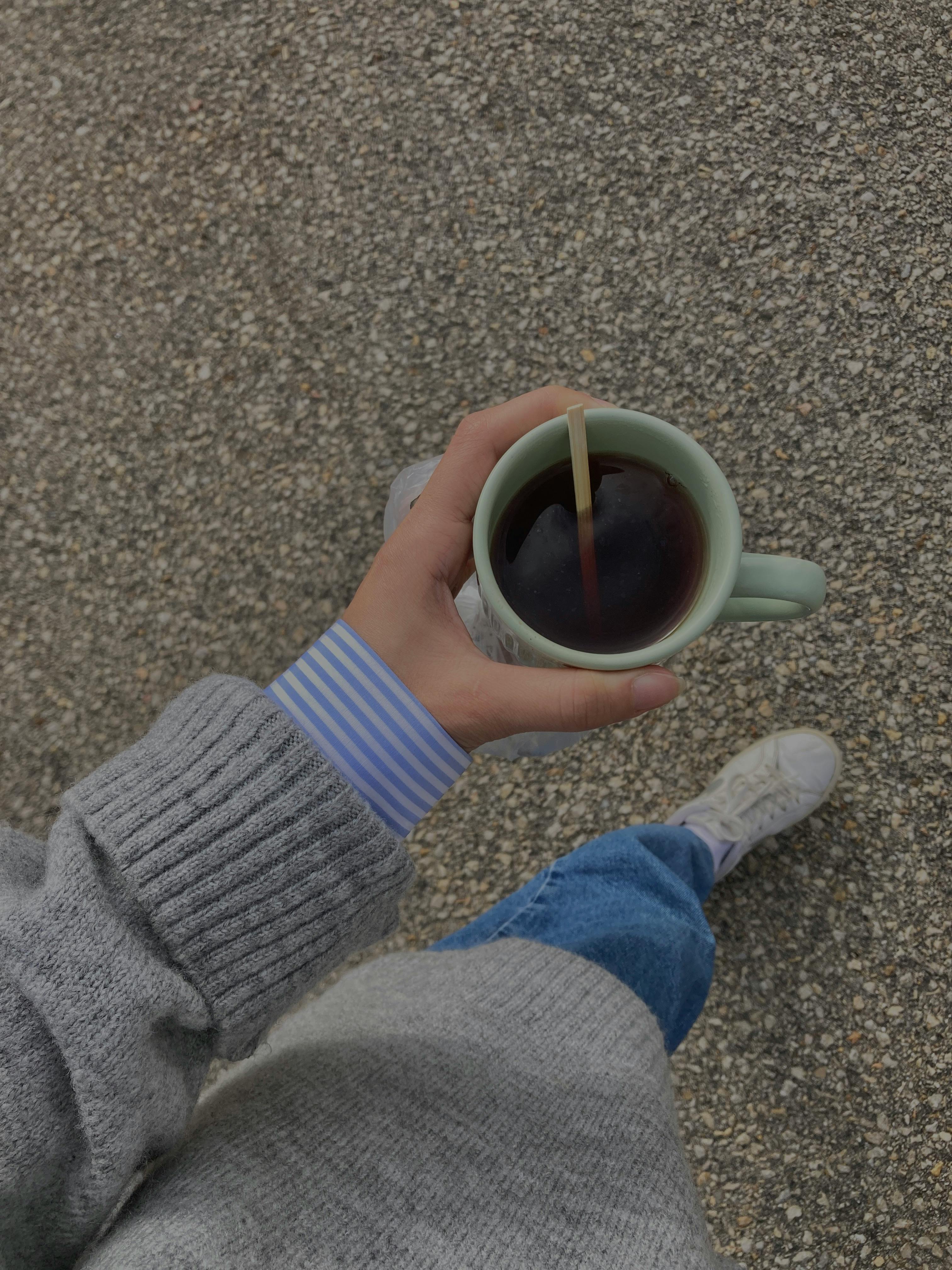 Person Holding Tea in Green Mug · Free Stock Photo