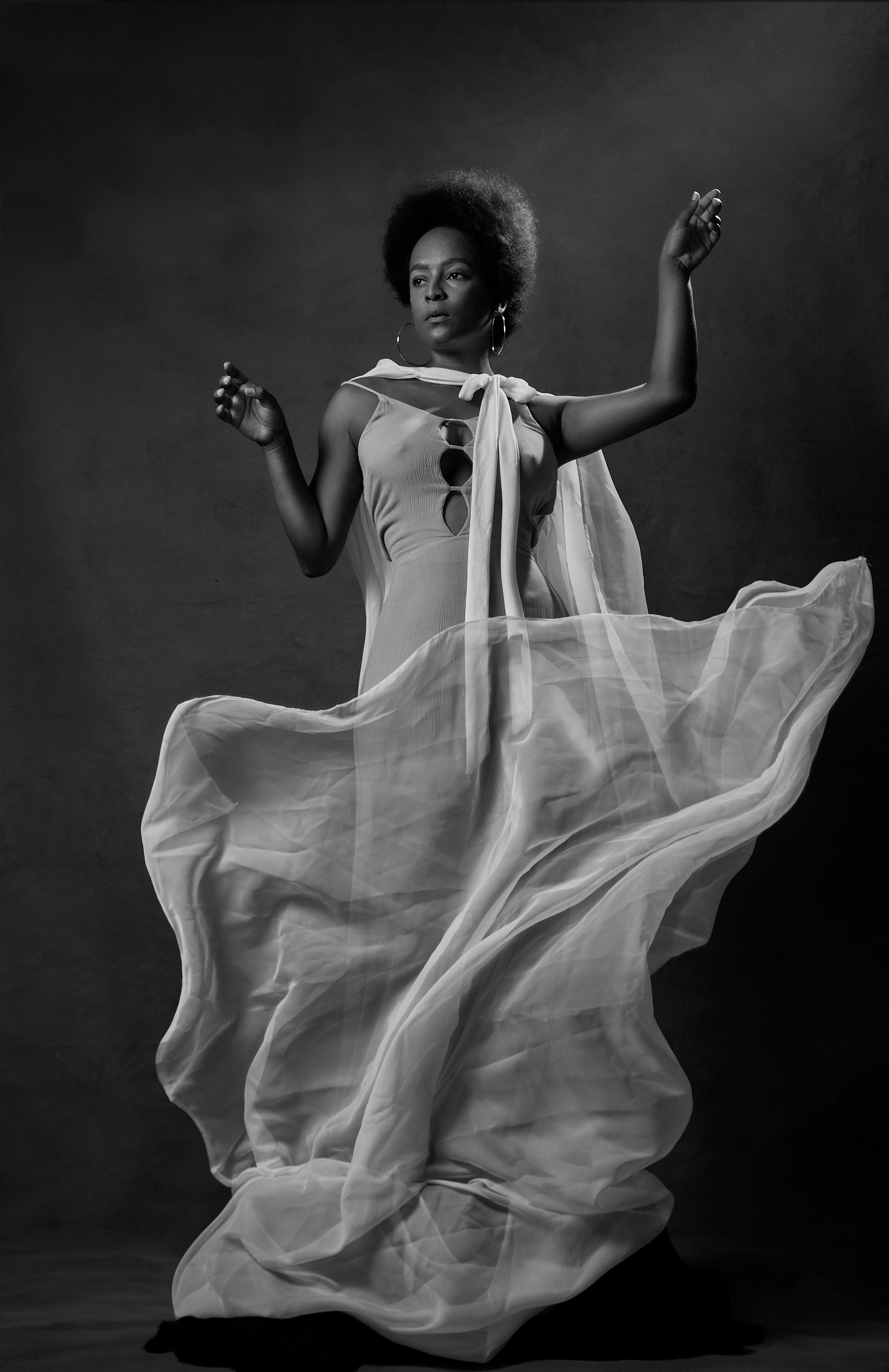 Model in a Spaghetti Strap Dress and a Long Chiffon Cape Flowing in ...