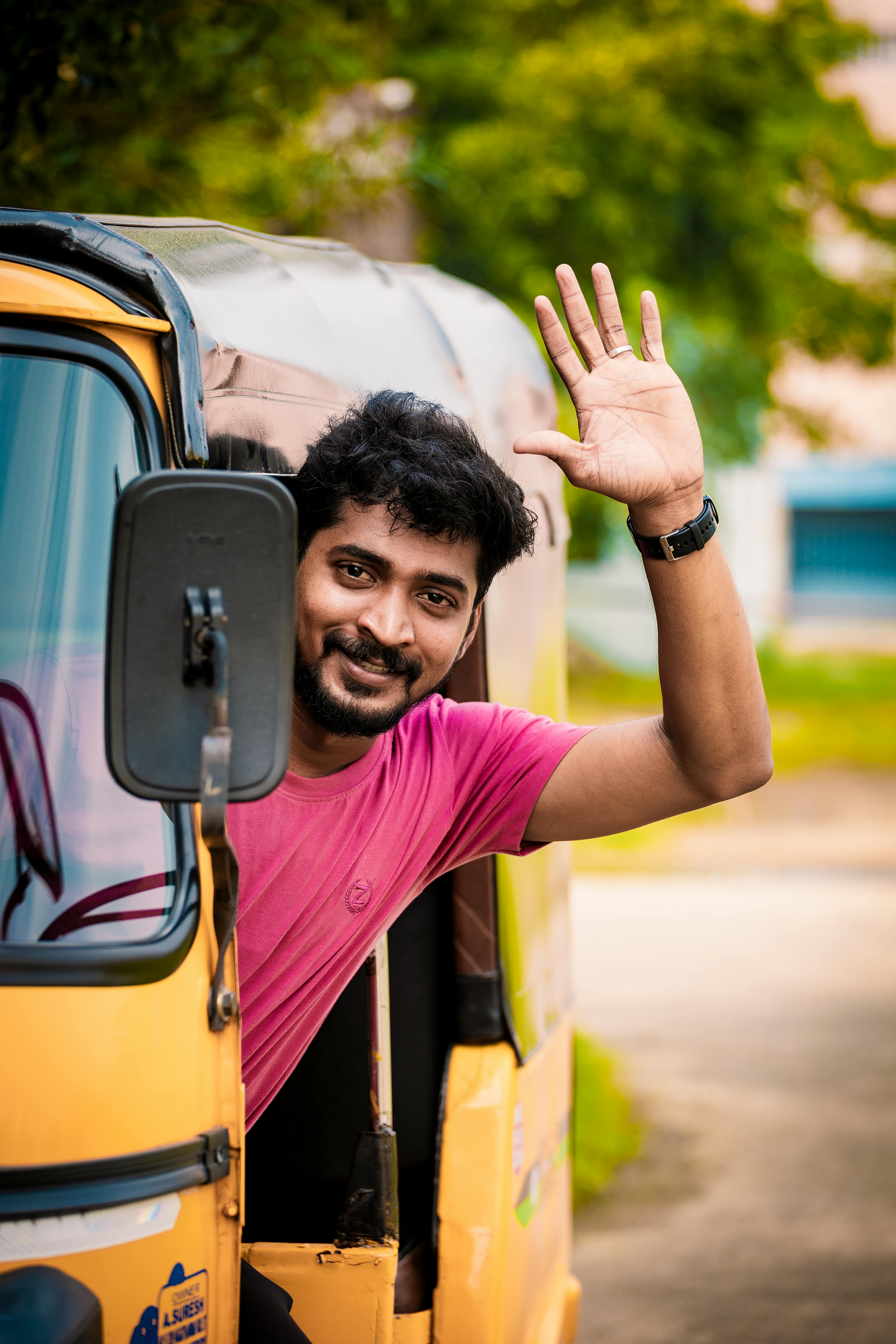 Indian Man Driving a Yellow Car · Free Stock Photo