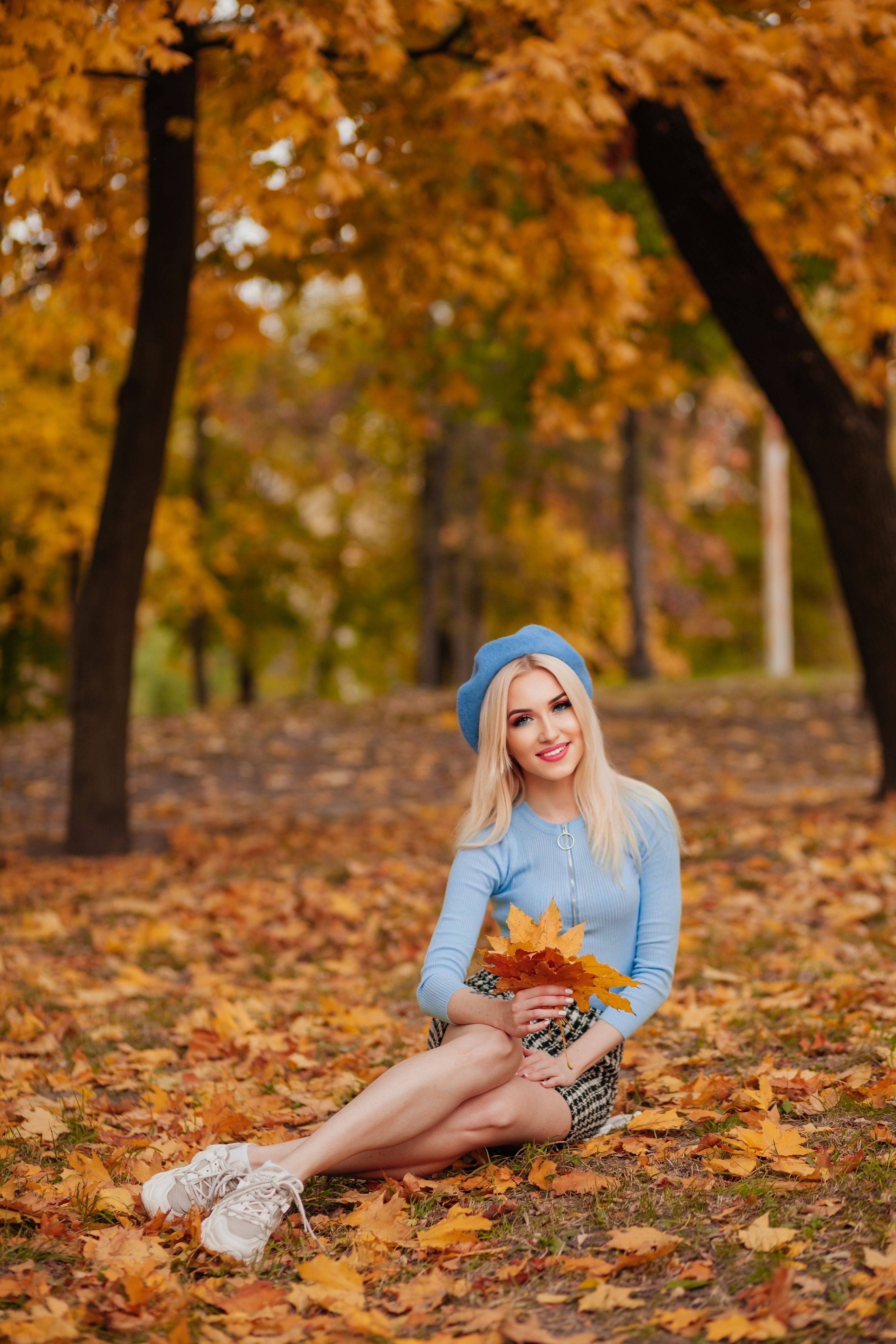 Woman in Autumn Forest Wearing Checkered Shirt · Free Stock Photo