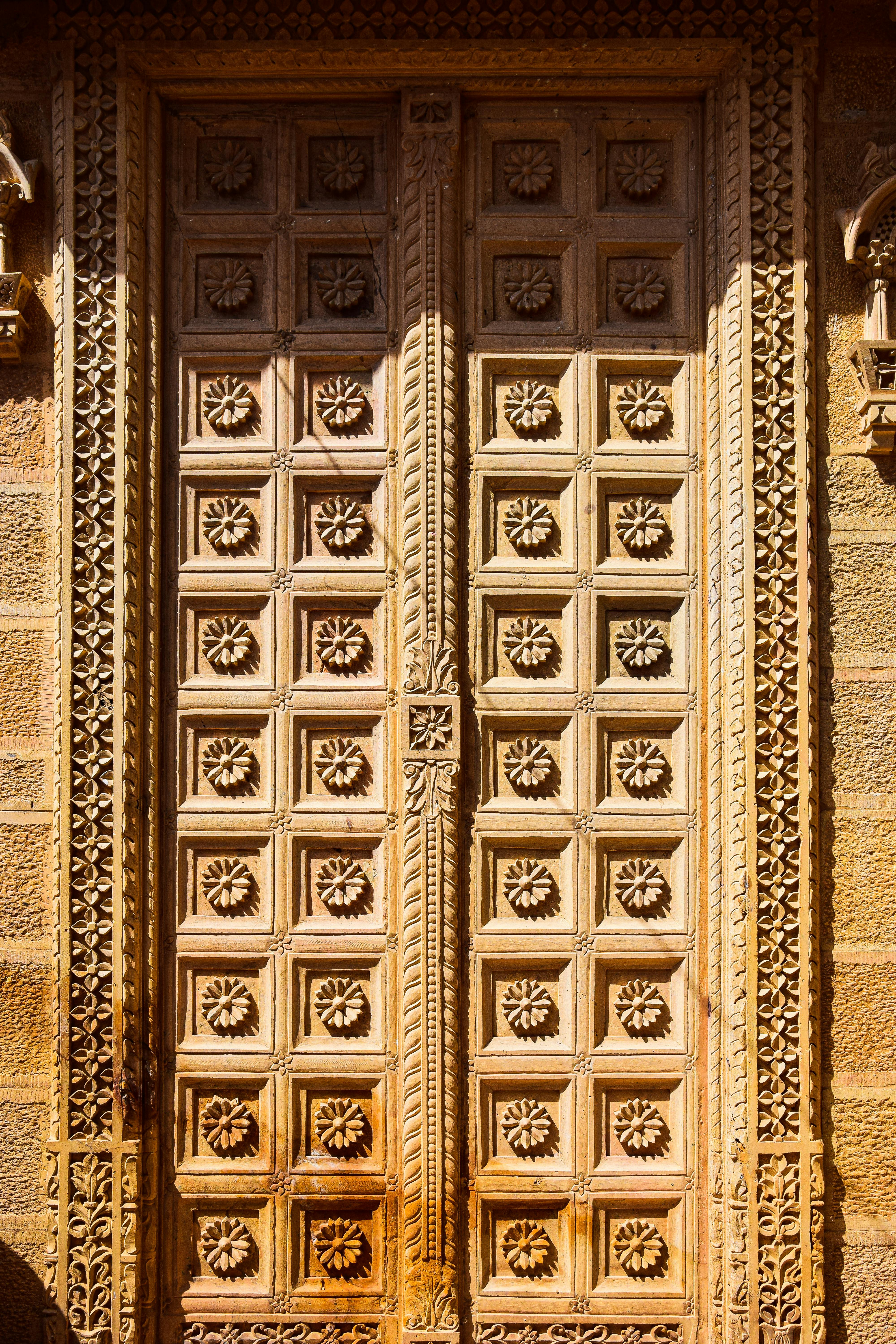 A wooden door with intricate designs on it · Free Stock Photo