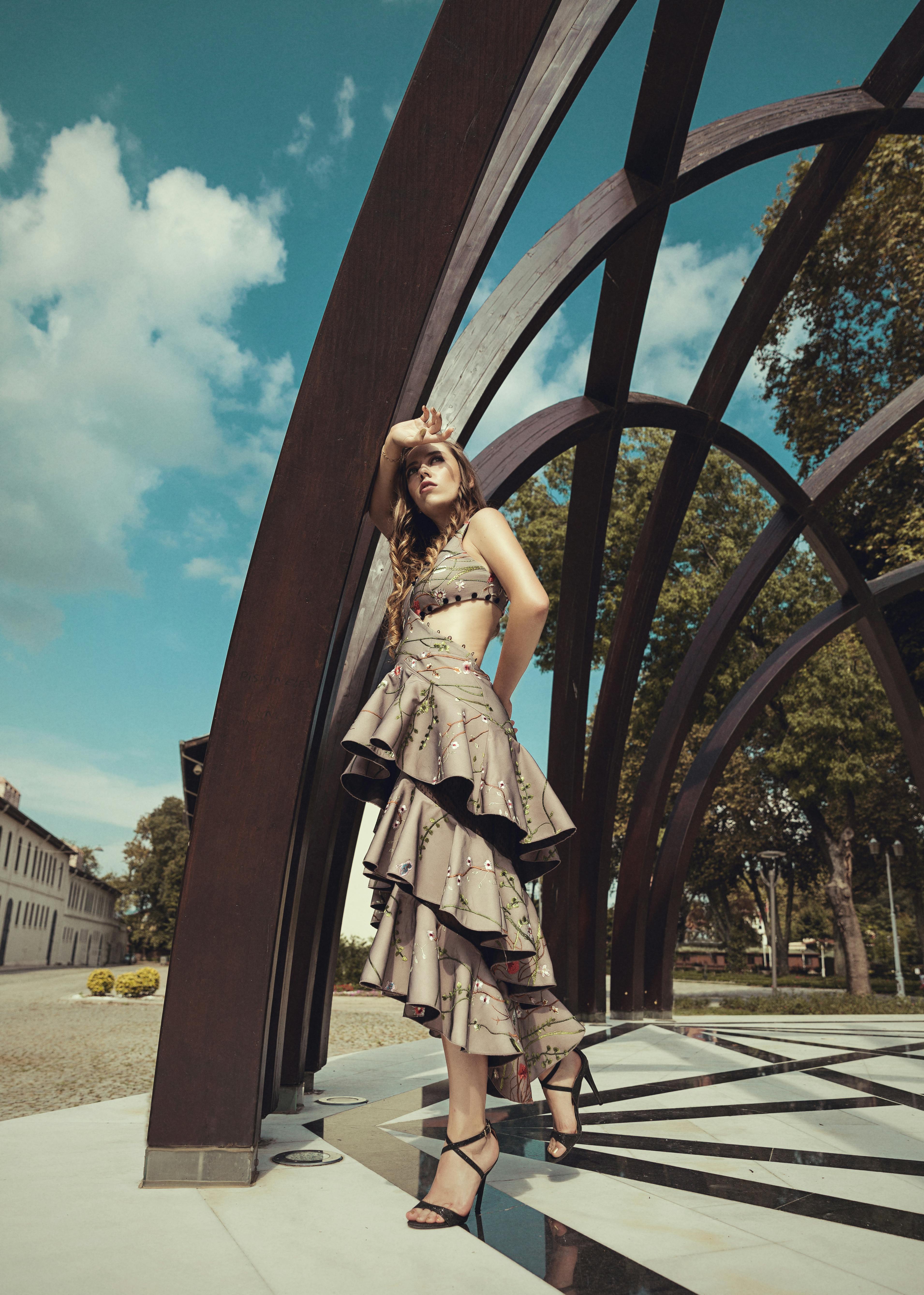 Woman Wearing a Red Suit and High Heel Shoes Posing in a Park · Free ...