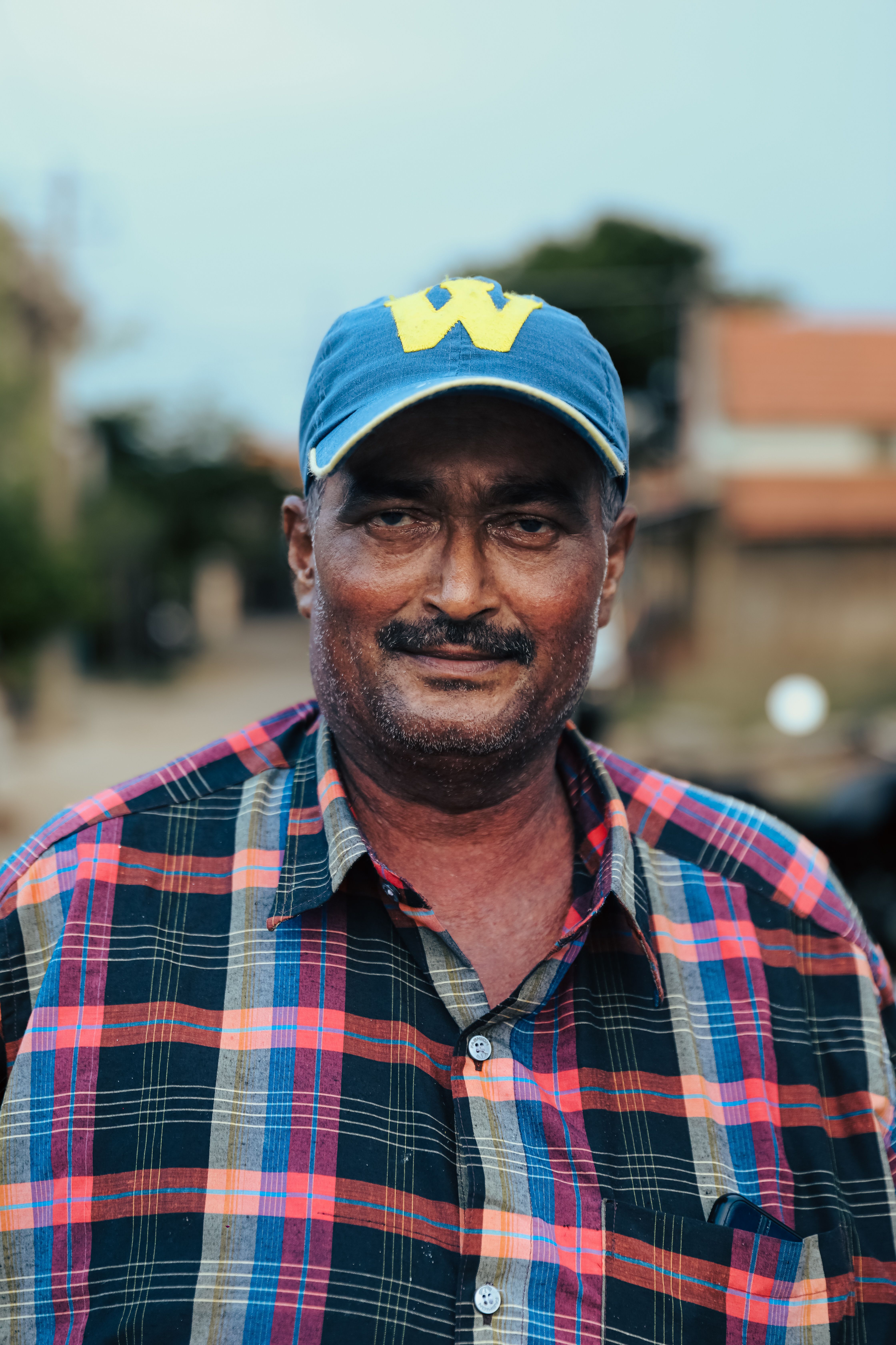 Man with a Mustache Wearing a Baseball Cap · Free Stock Photo