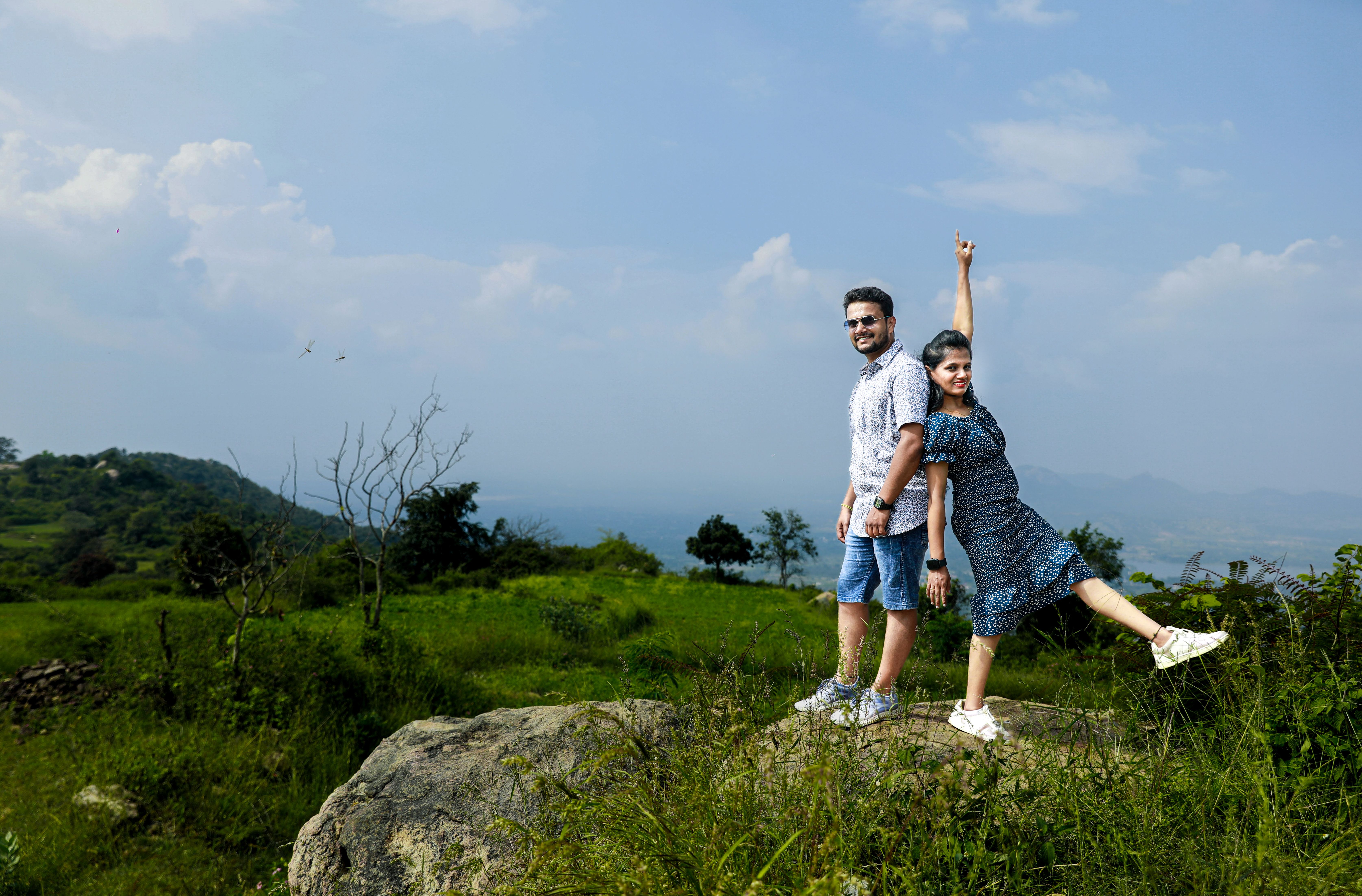 Young Couple Posing on a Rock · Free Stock Photo