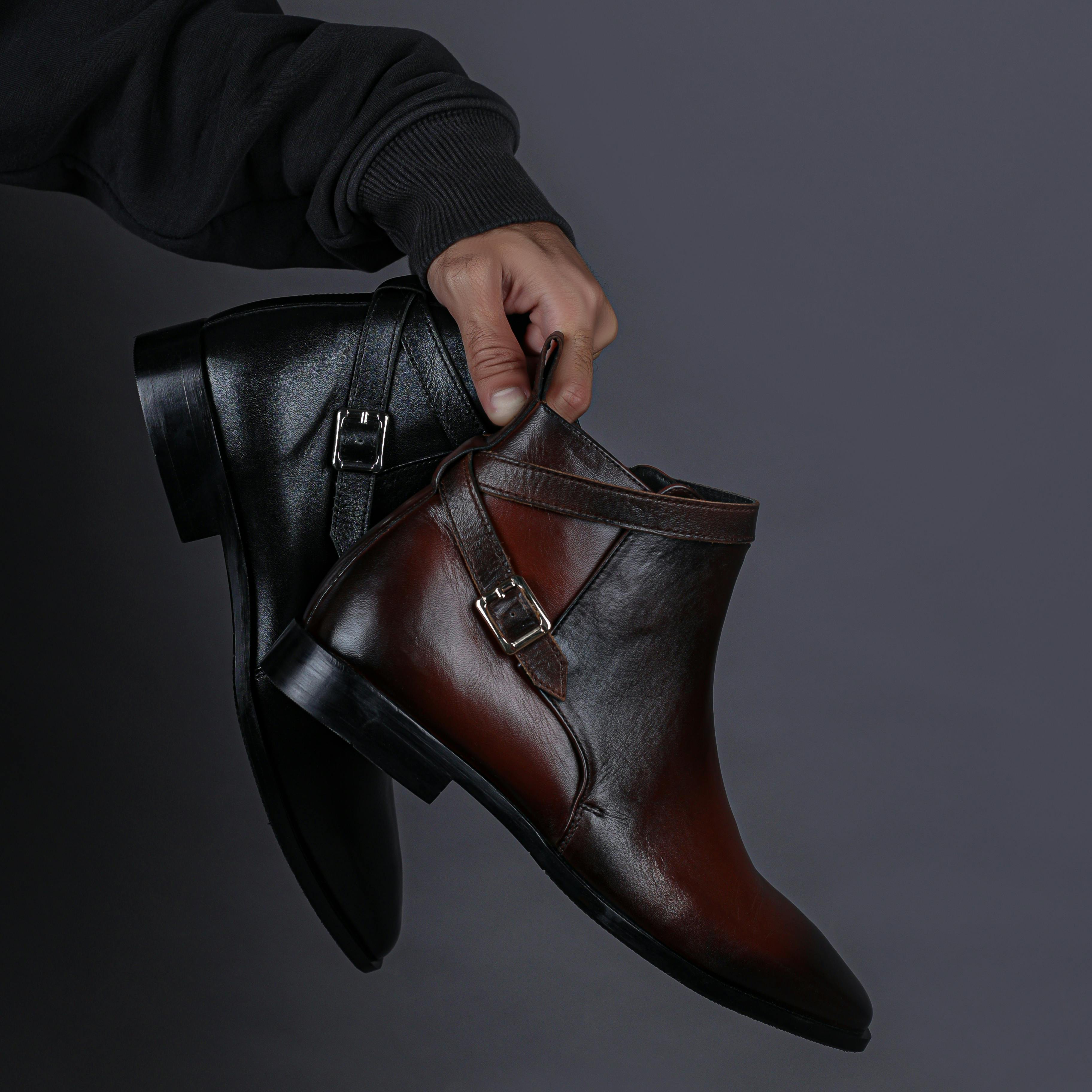 Man Hand Holding Shoes · Free Stock Photo