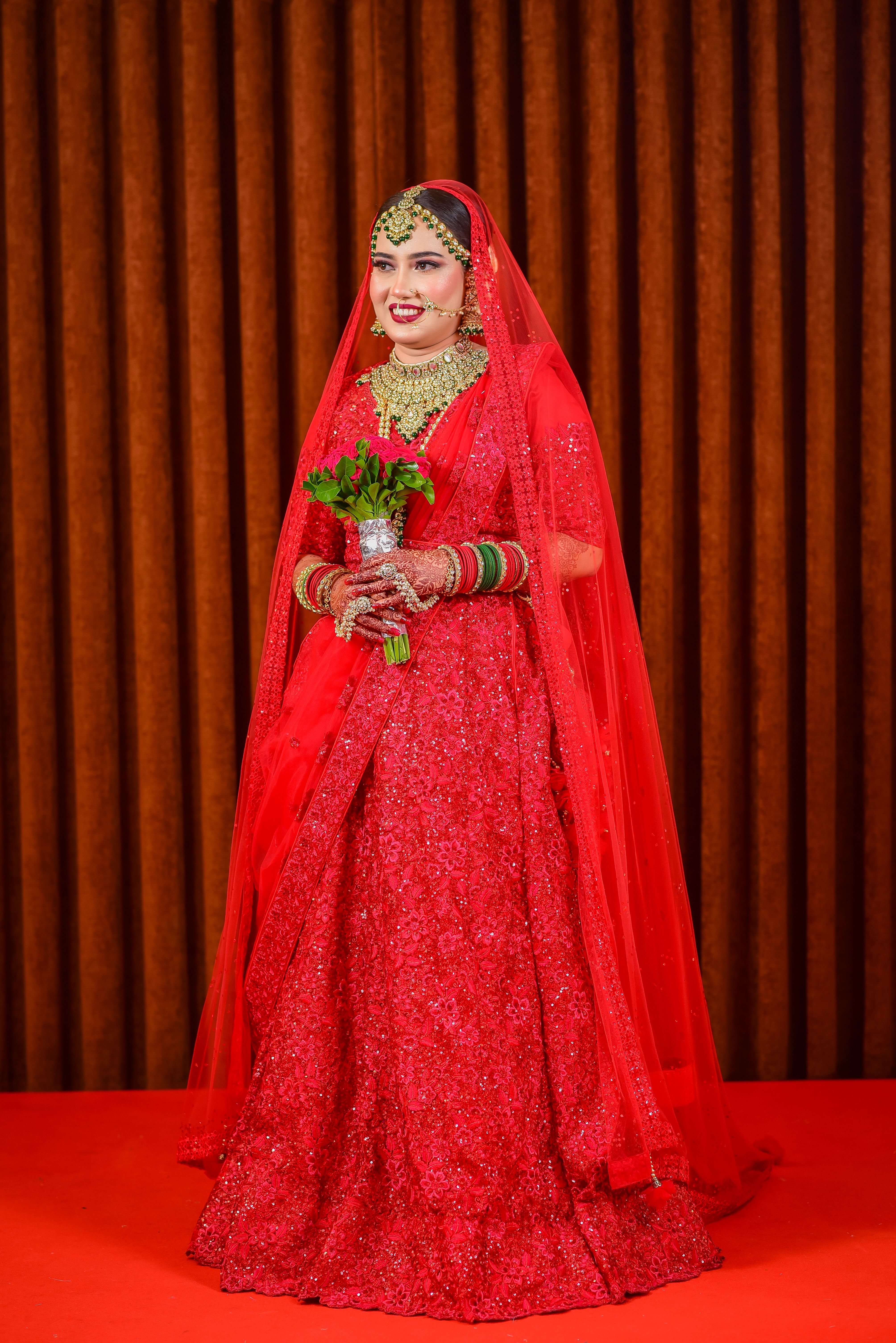 Model Posing in Traditional Red Wedding Dress · Free Stock Photo