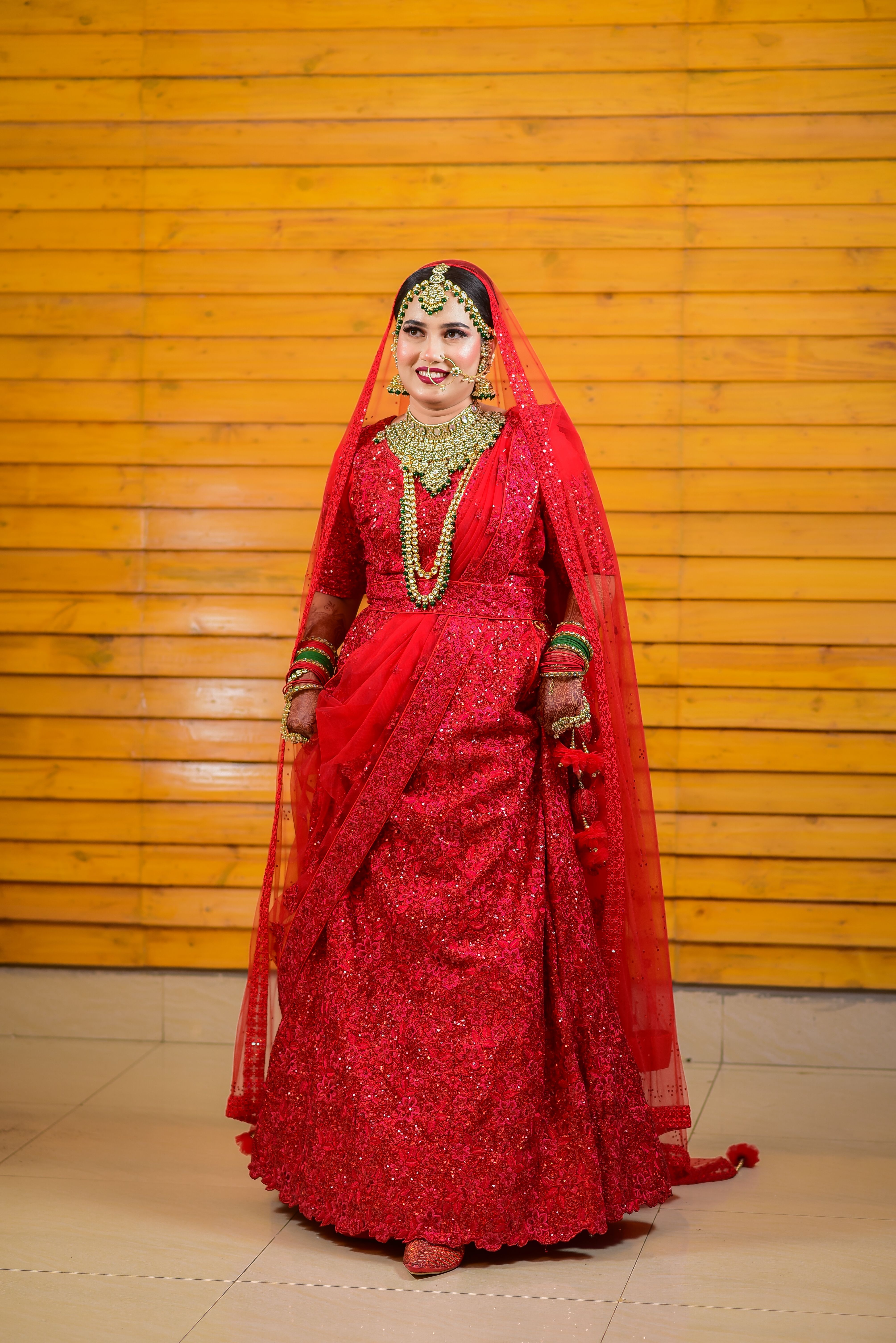 Brunette Bride in Traditional Red Dress Standing by Wooden Wall · Free ...