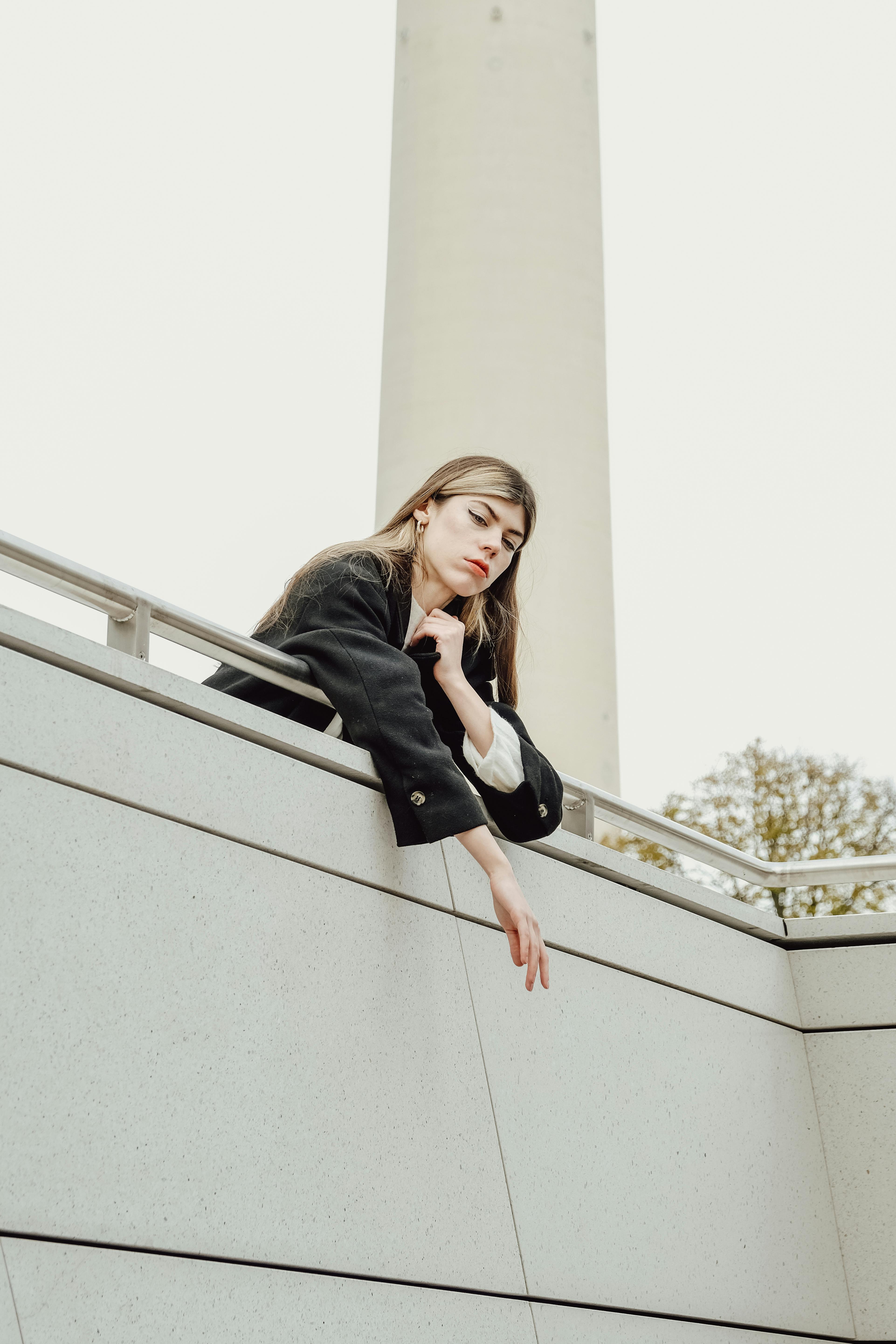 Woman Leaning on Railing · Free Stock Photo