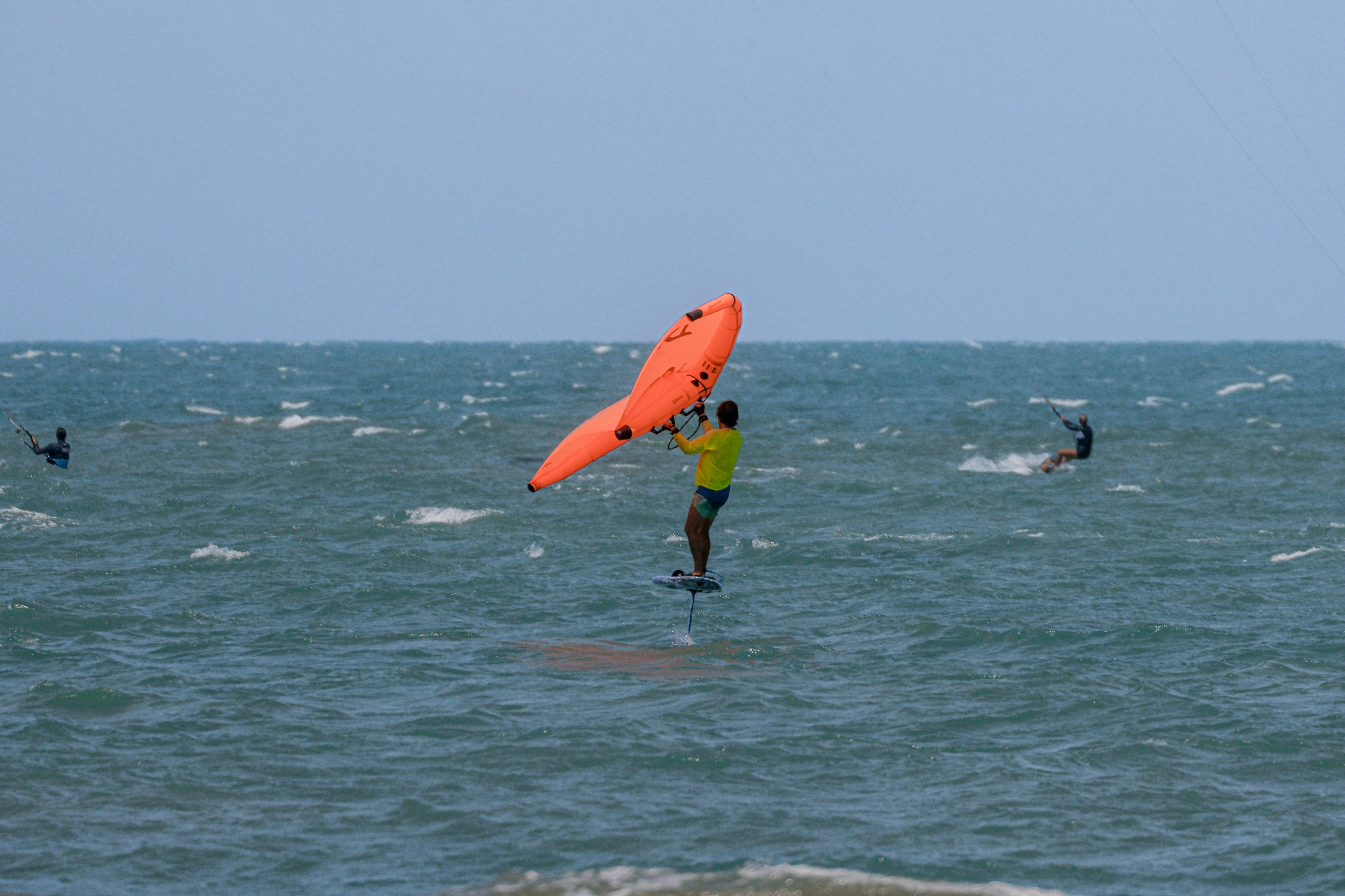 Surfer Wing Foiling Over the Ocean · Free Stock Photo