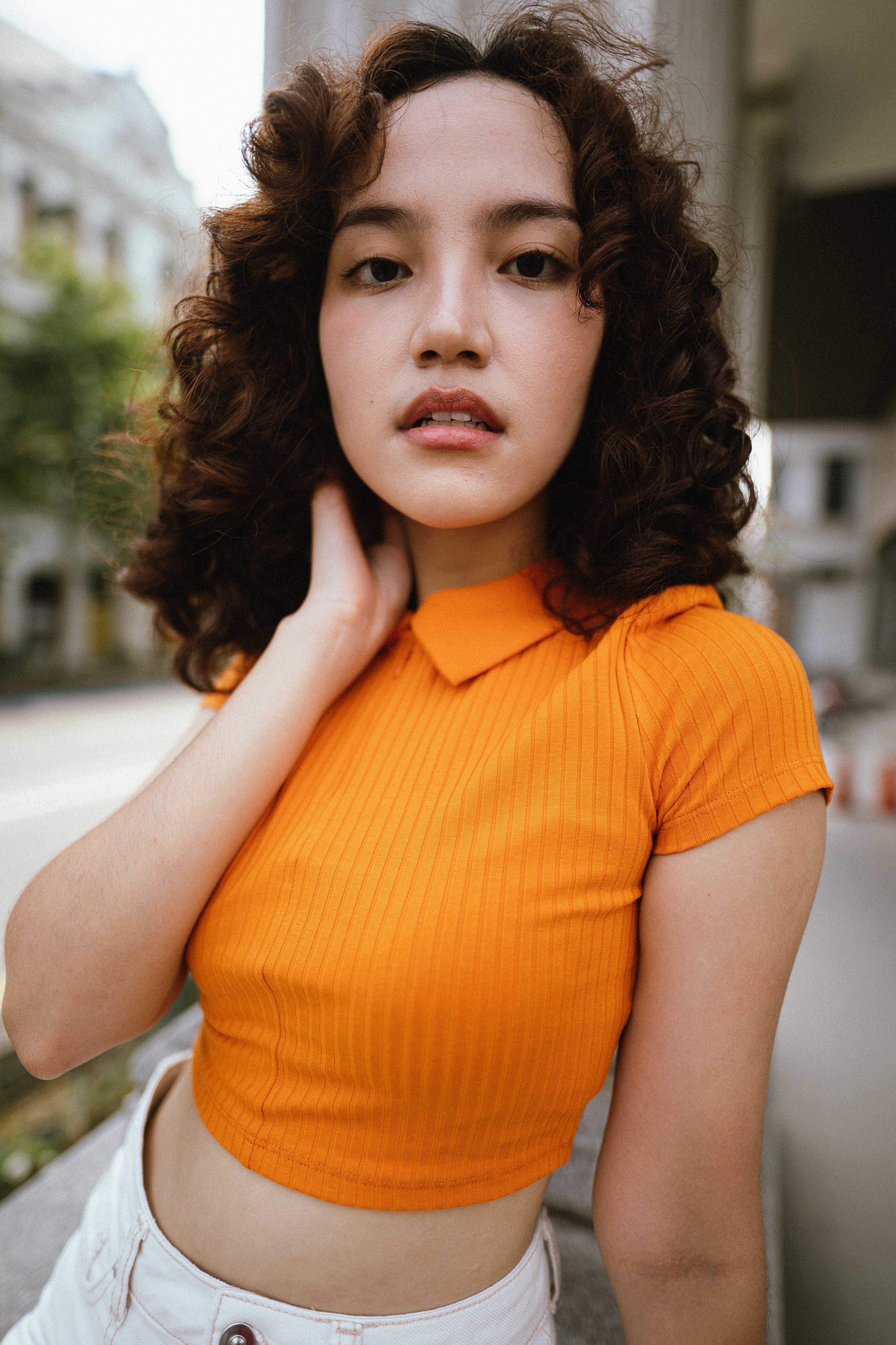 Brunette in Cropped Orange Top · Free Stock Photo