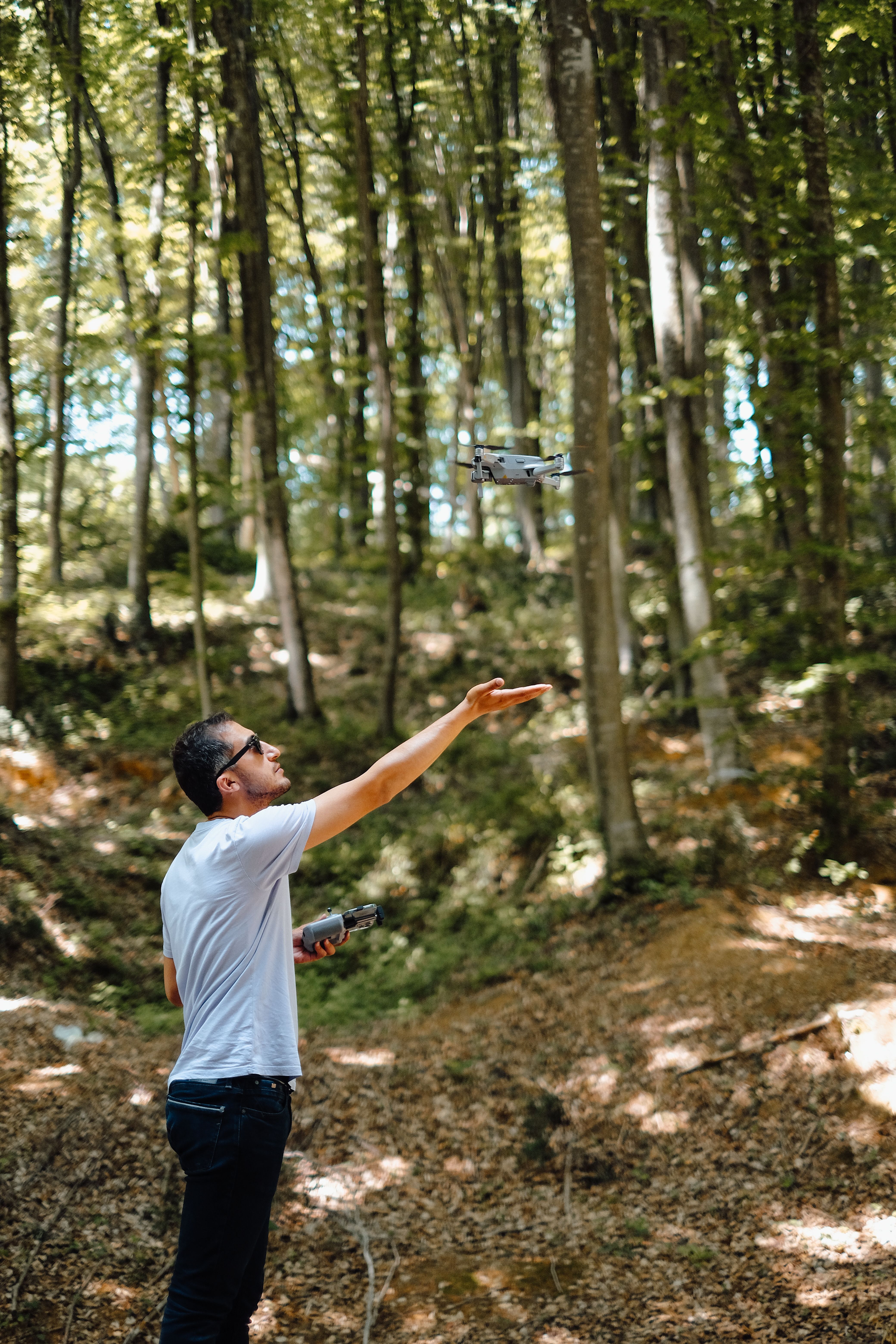 Man with Drone in Forest · Free Stock Photo